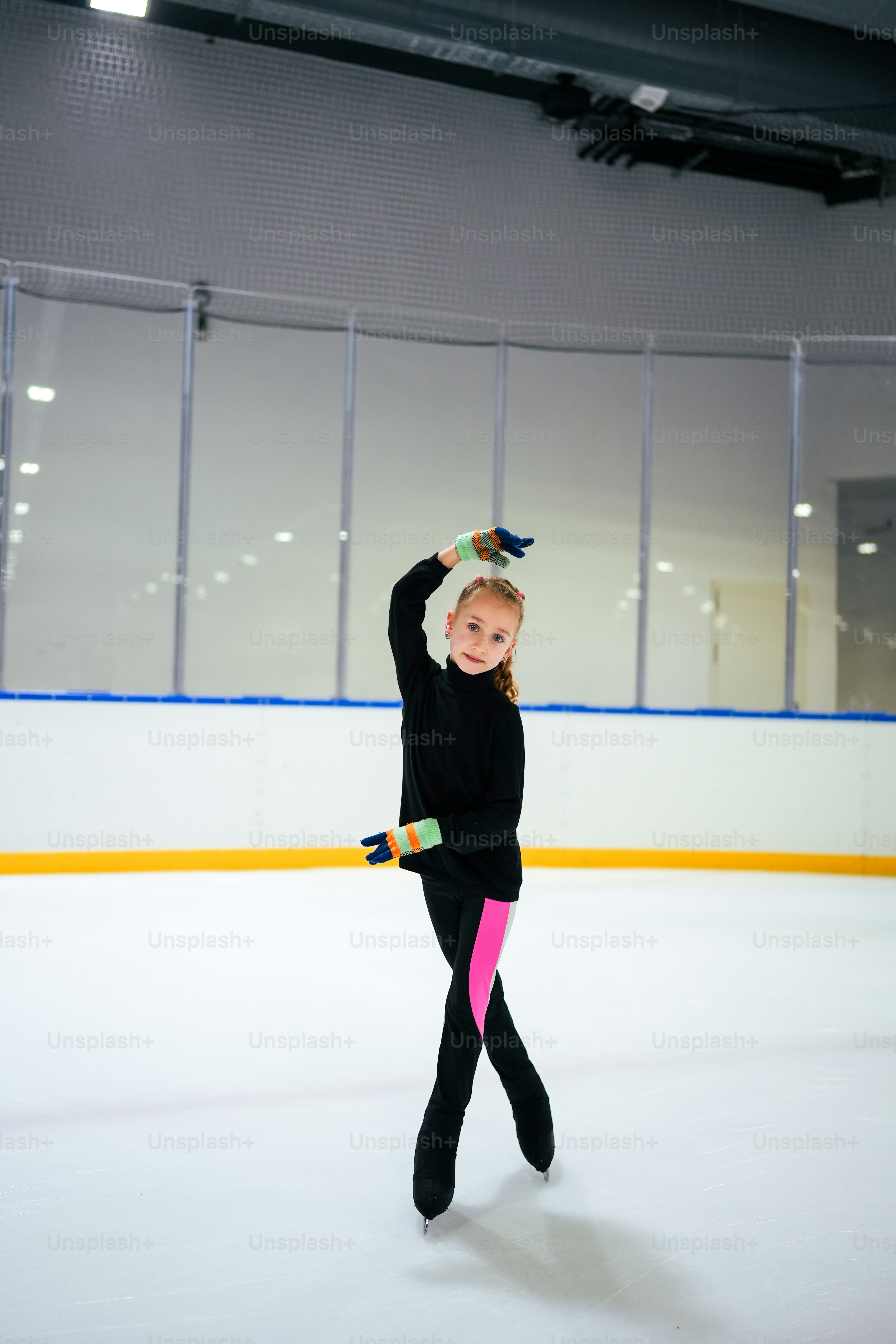 A young girl skating on an ice rink photo – Skating Image on Unsplash