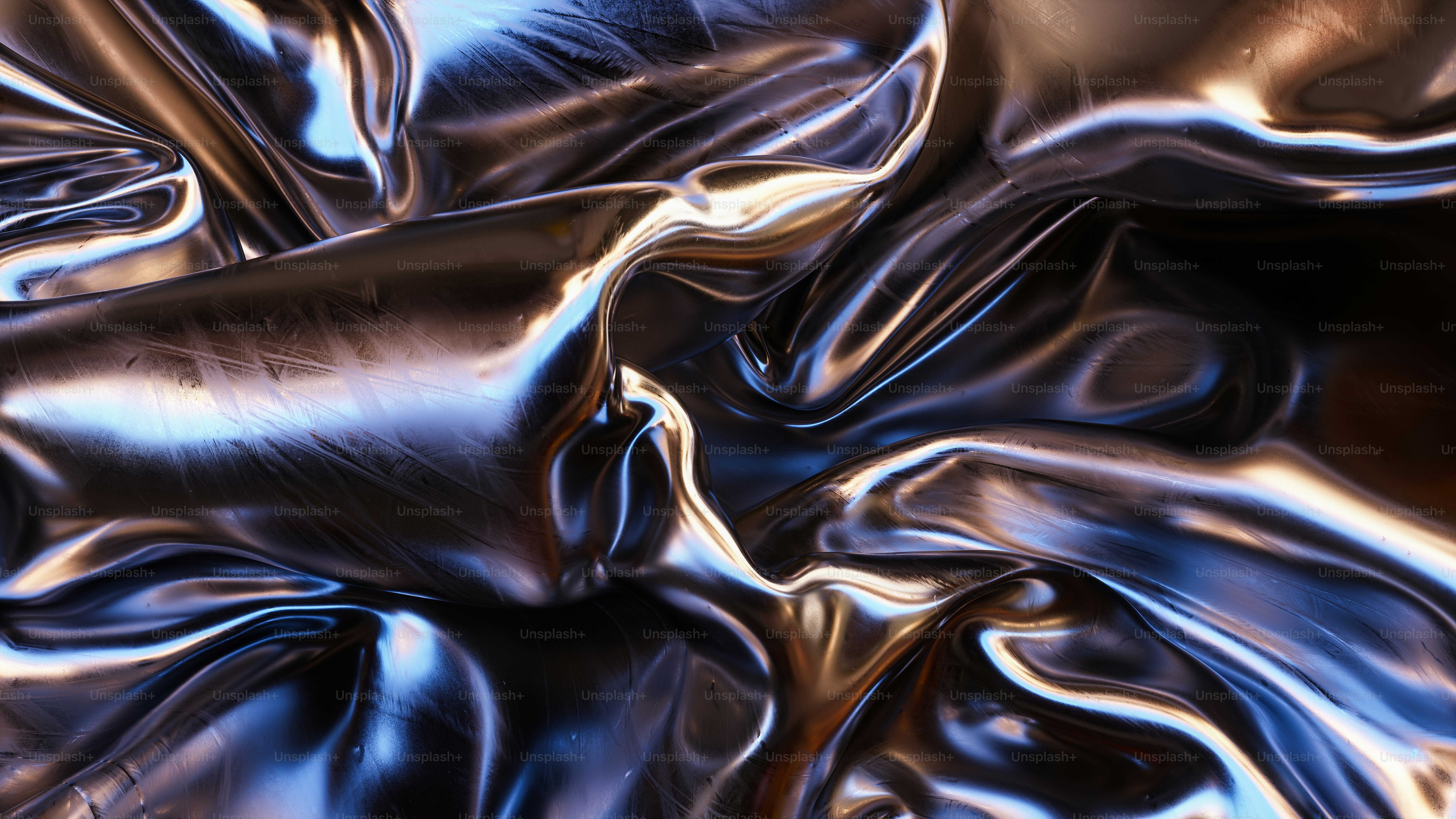 A close up of a shiny metal surface photo – Wallpaper Image on Unsplash