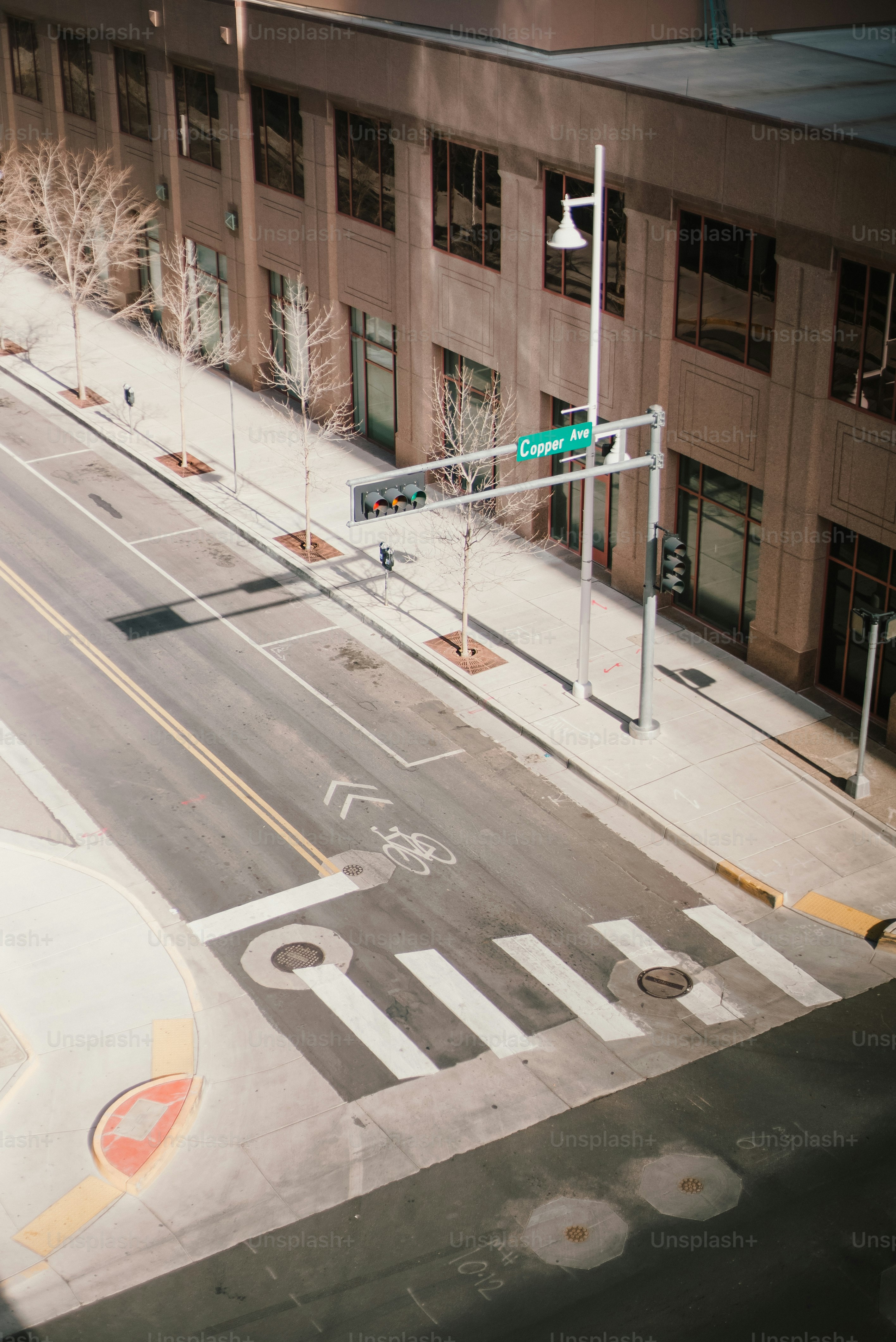 An overhead view of a city street with a stop sign photo – Street ...
