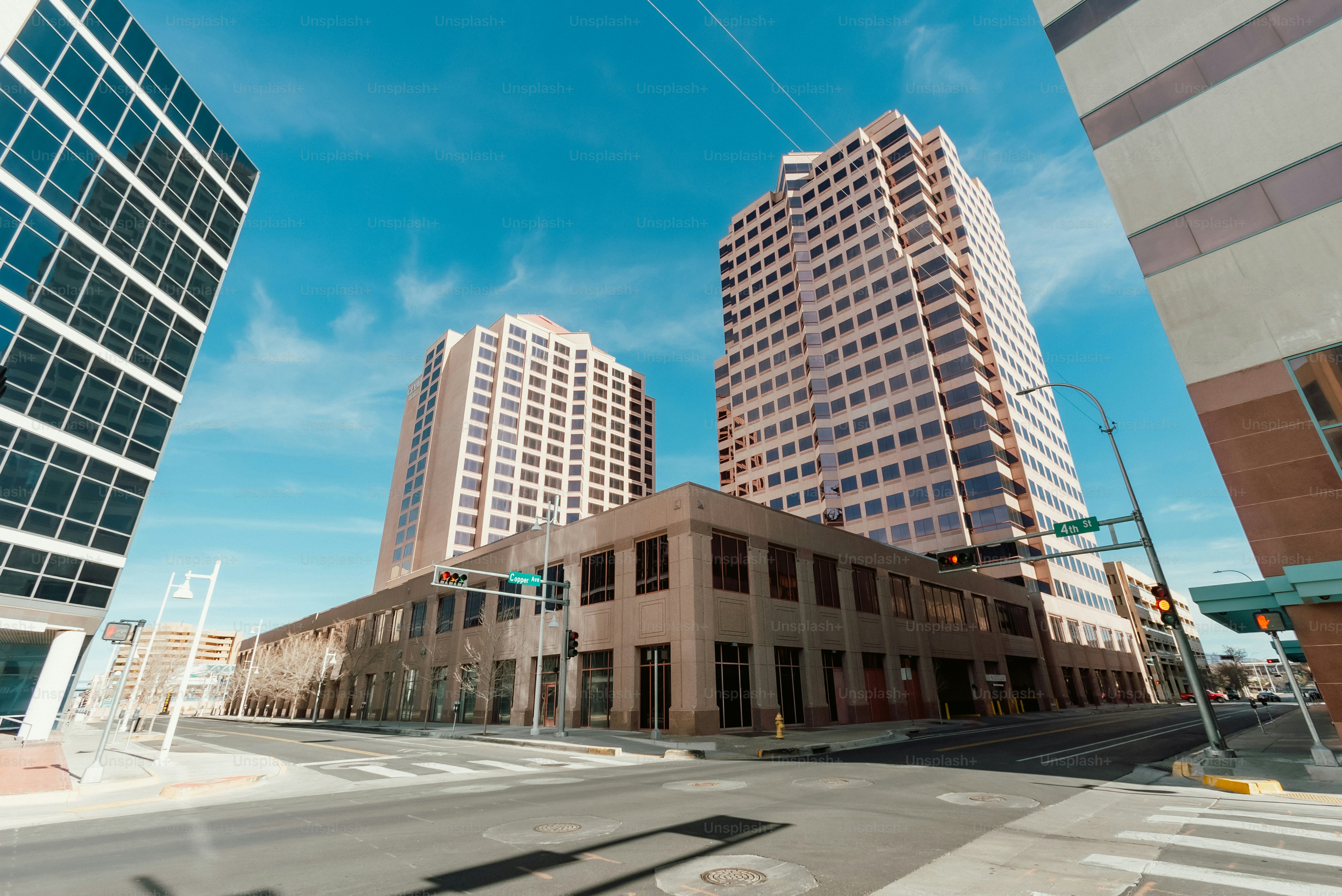 A city street with tall buildings in the background photo – Albuquerque ...