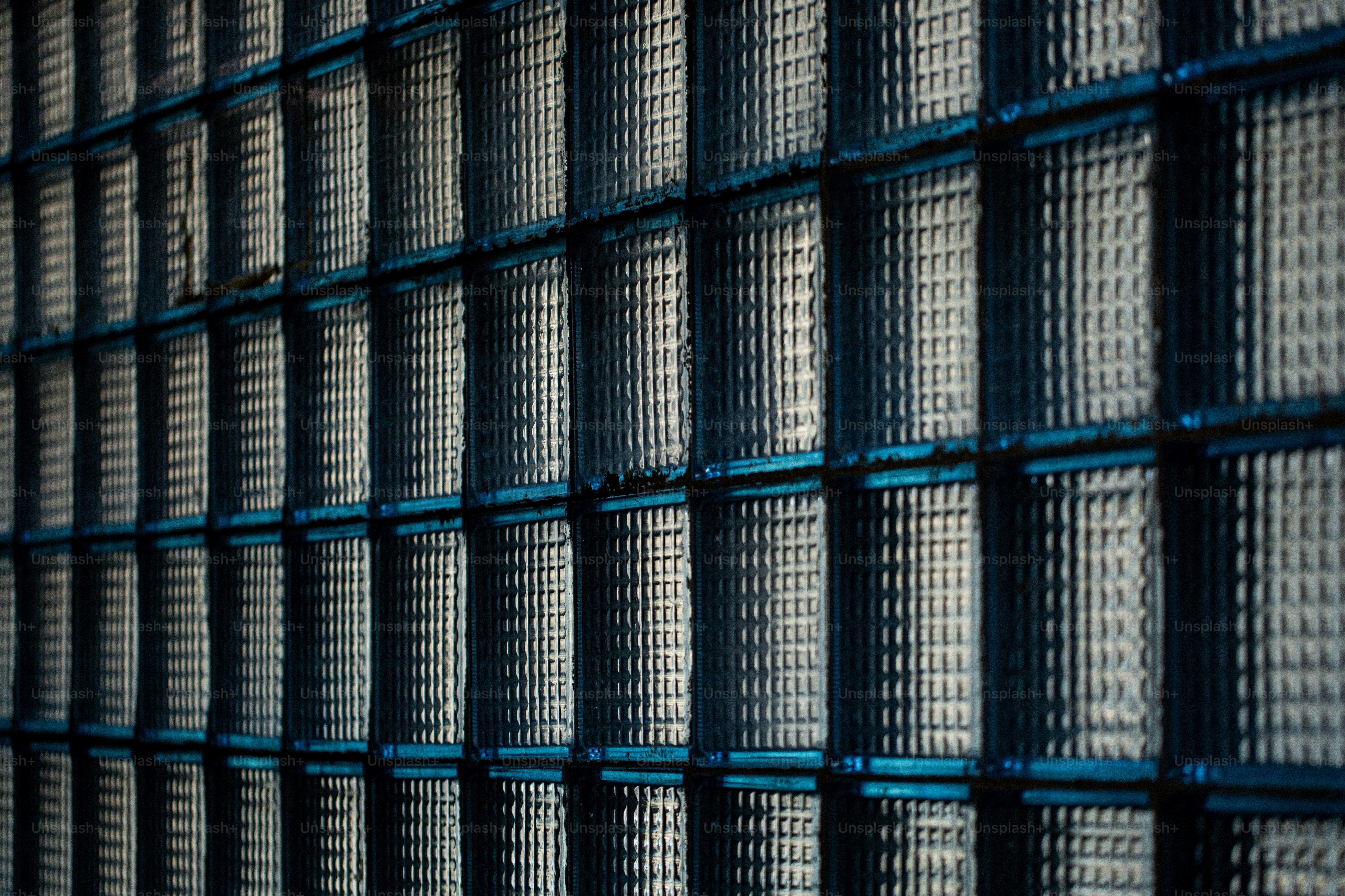 A close up of a wall made of metal mesh photo – Texture Image on Unsplash