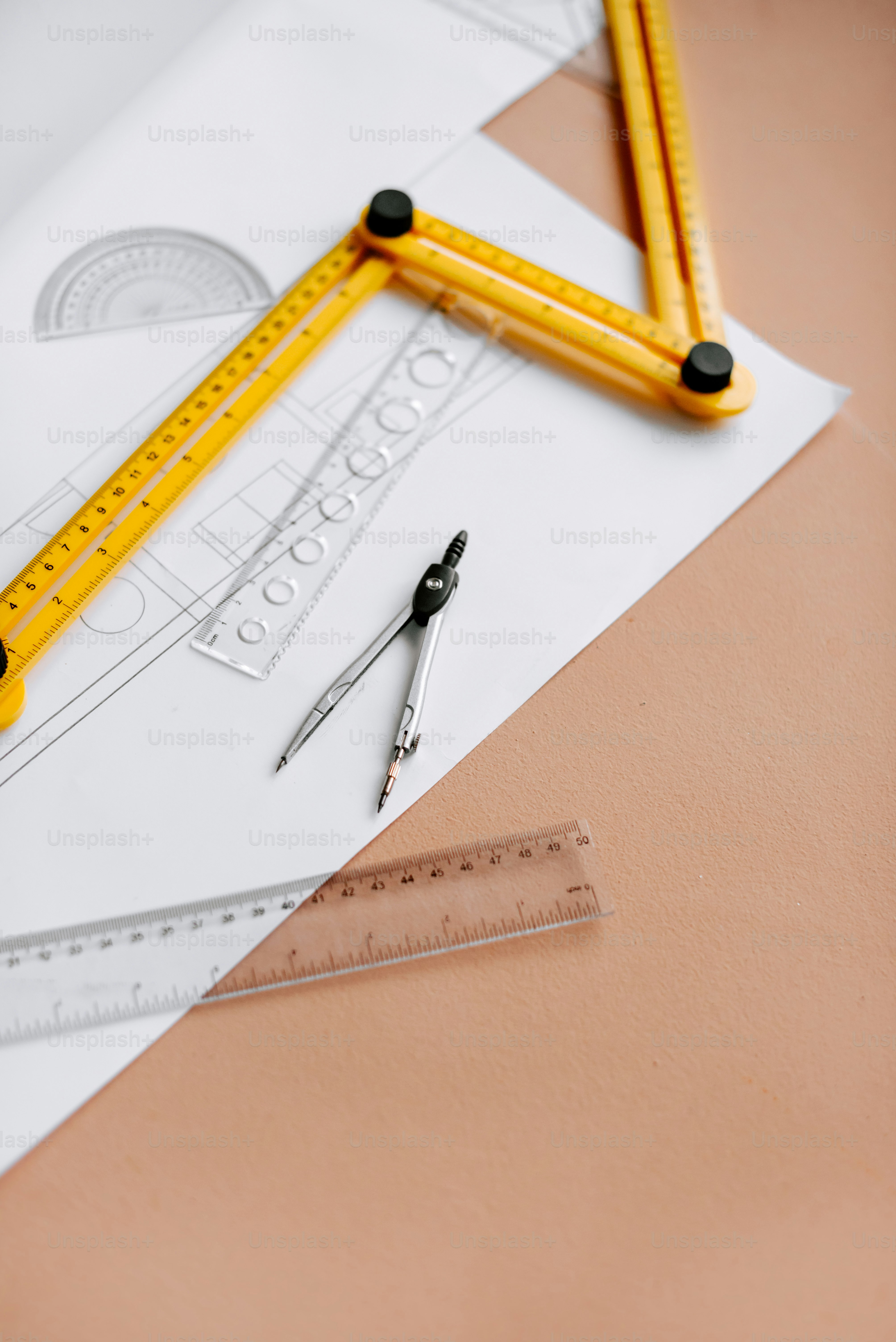 A ruler, rulers, and a pair of scissors on a table photo – Measurement ...