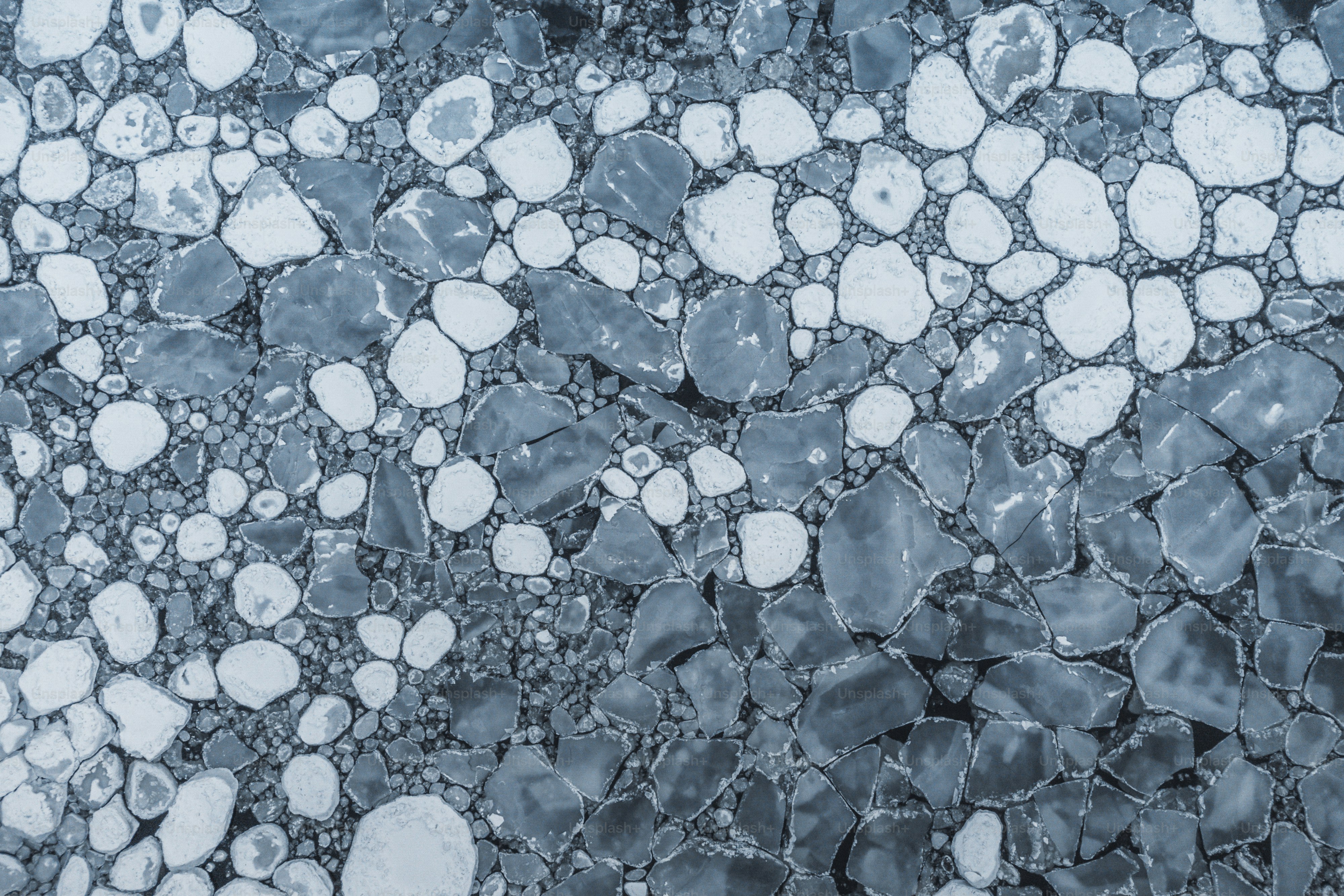 A black and white photo of rocks and ice photo – Ice Image on Unsplash