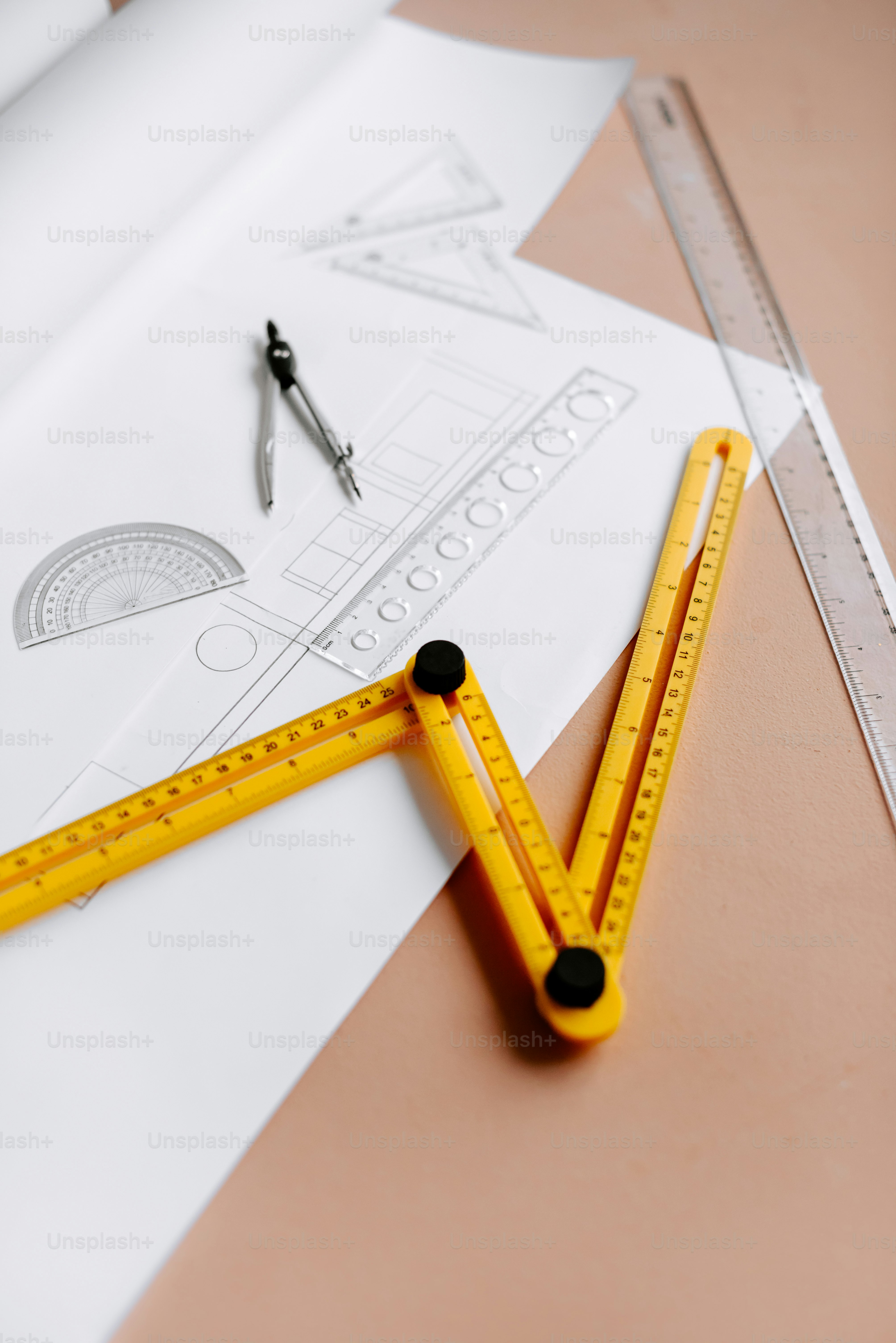 A pair of scissors, rulers, and a ruler on a piece of paper photo ...