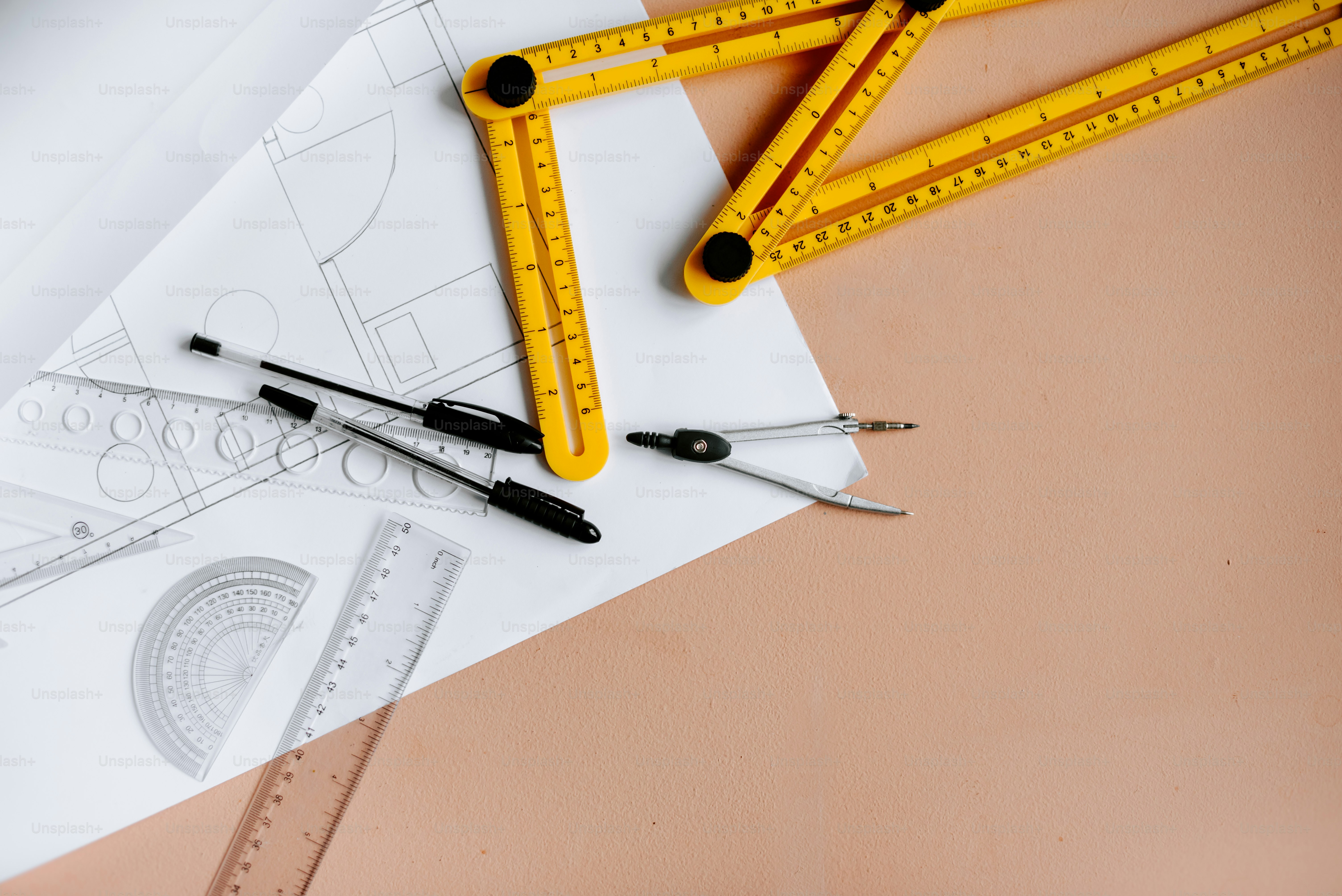 A pair of scissors, rulers, and a ruler on a piece of paper photo ...