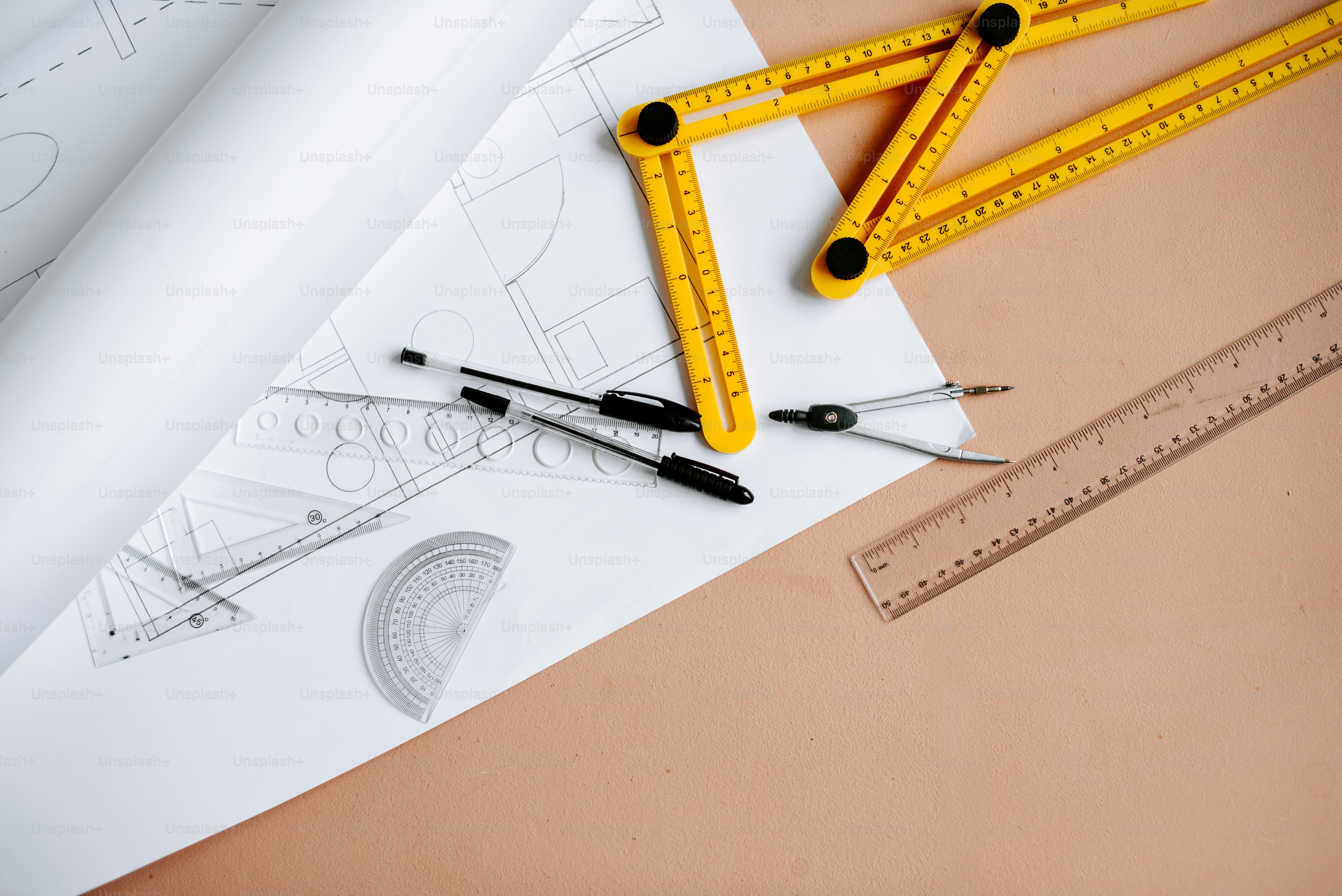 A pair of scissors, rulers, and a ruler on a piece of paper photo – Job ...