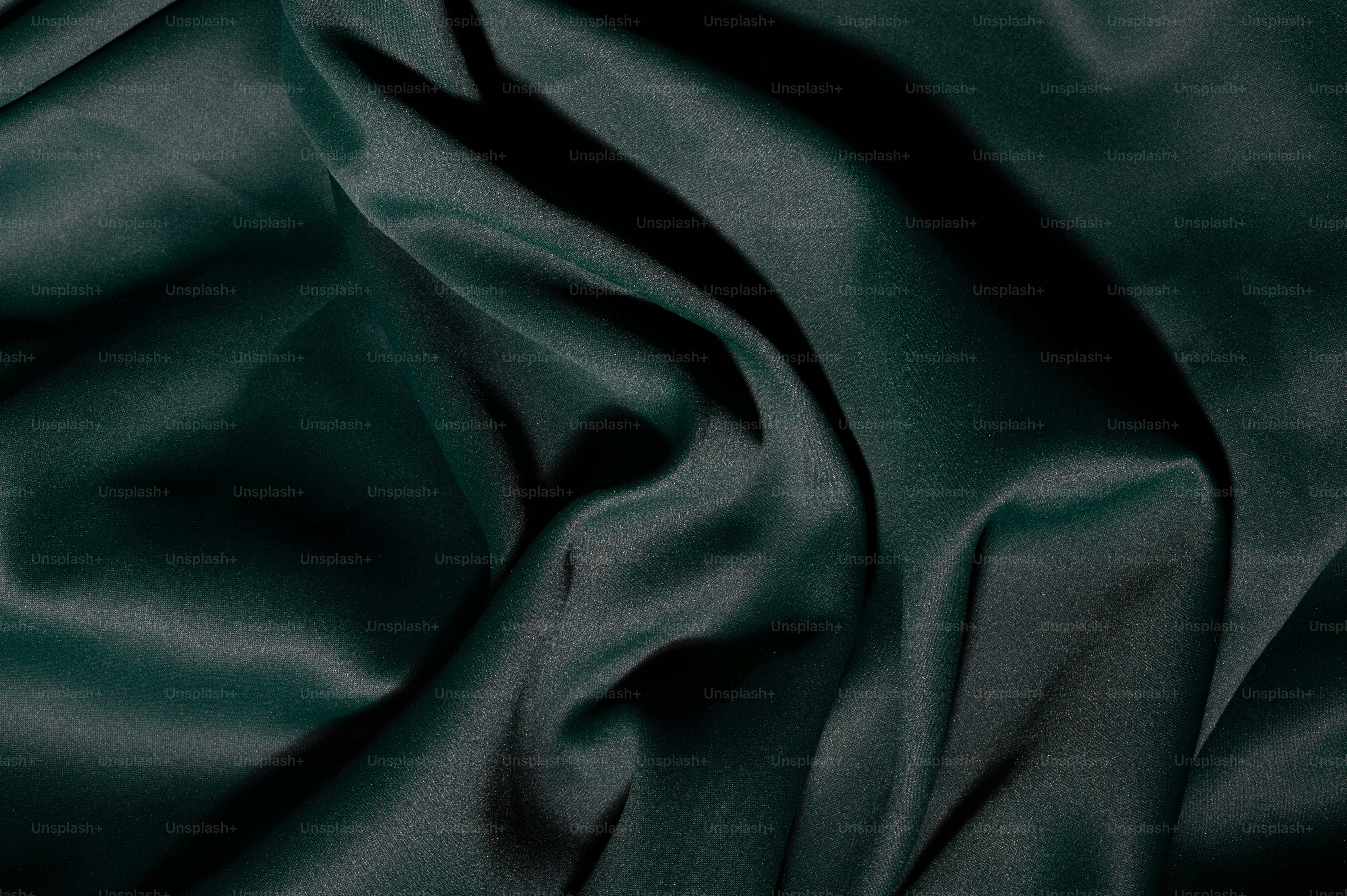 A close up view of a dark green fabric photo – Texture Image on Unsplash