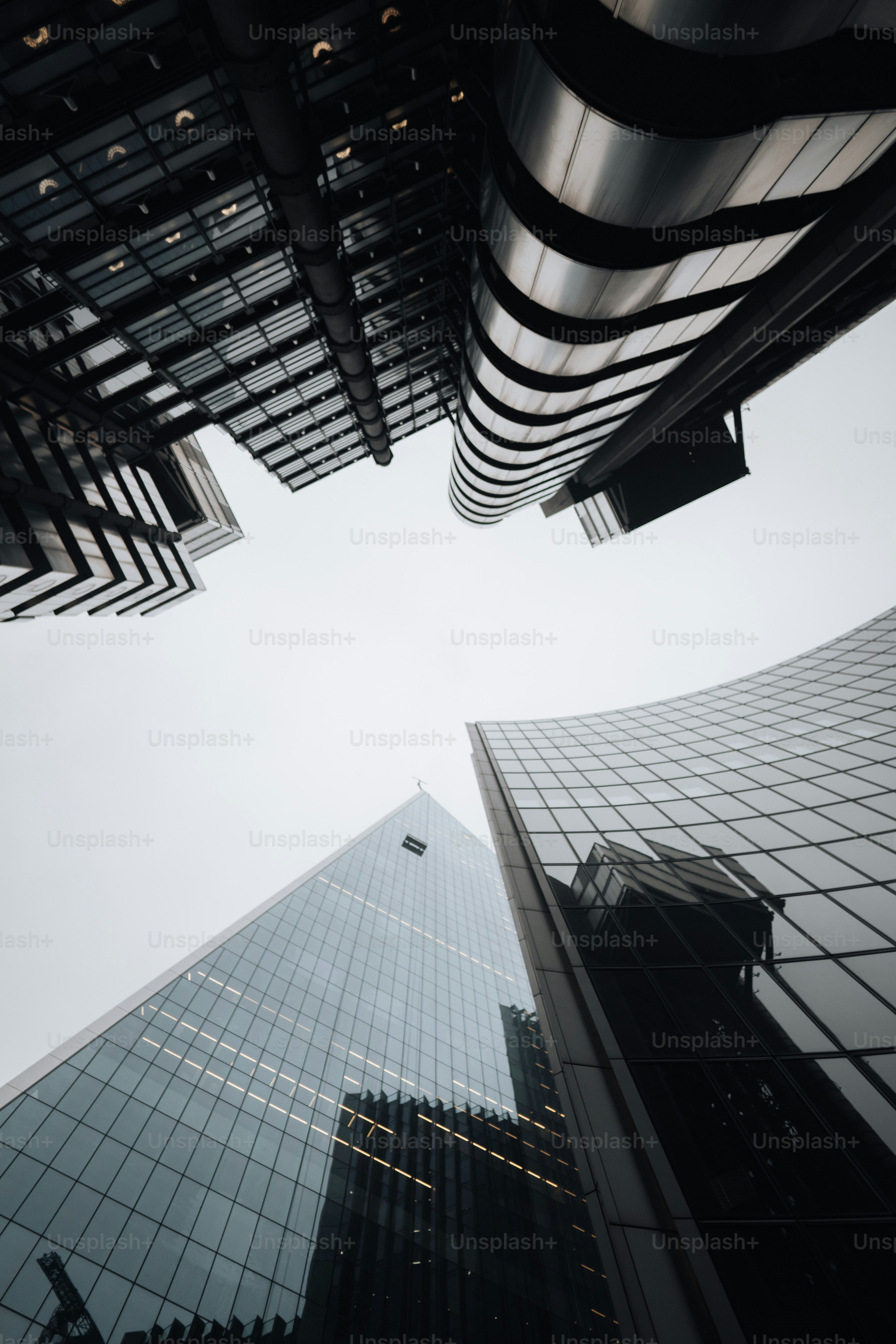 Looking up at tall buildings in a city photo – Sky scrapers Image on ...