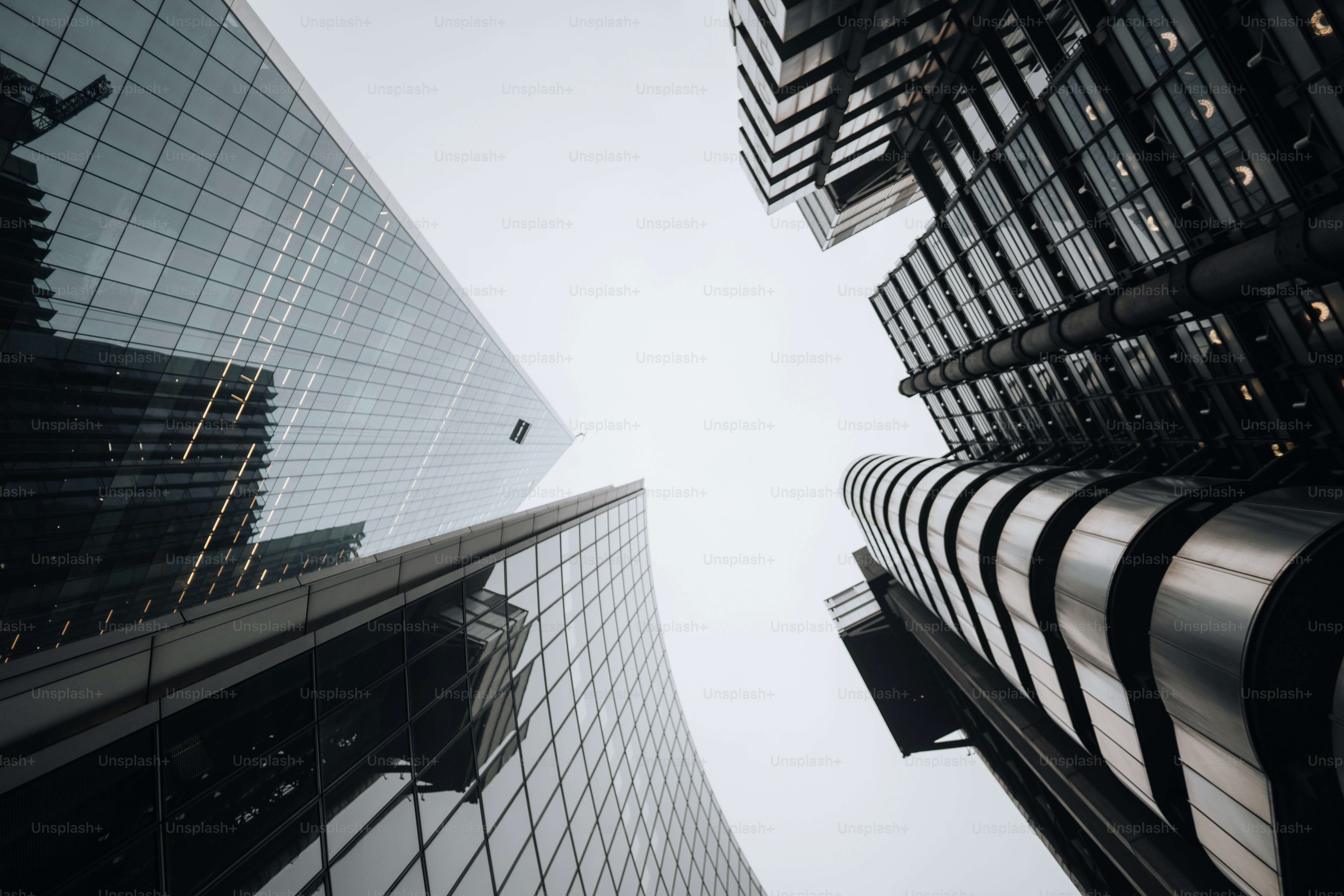 Looking up at tall buildings in a city photo – London Image on Unsplash