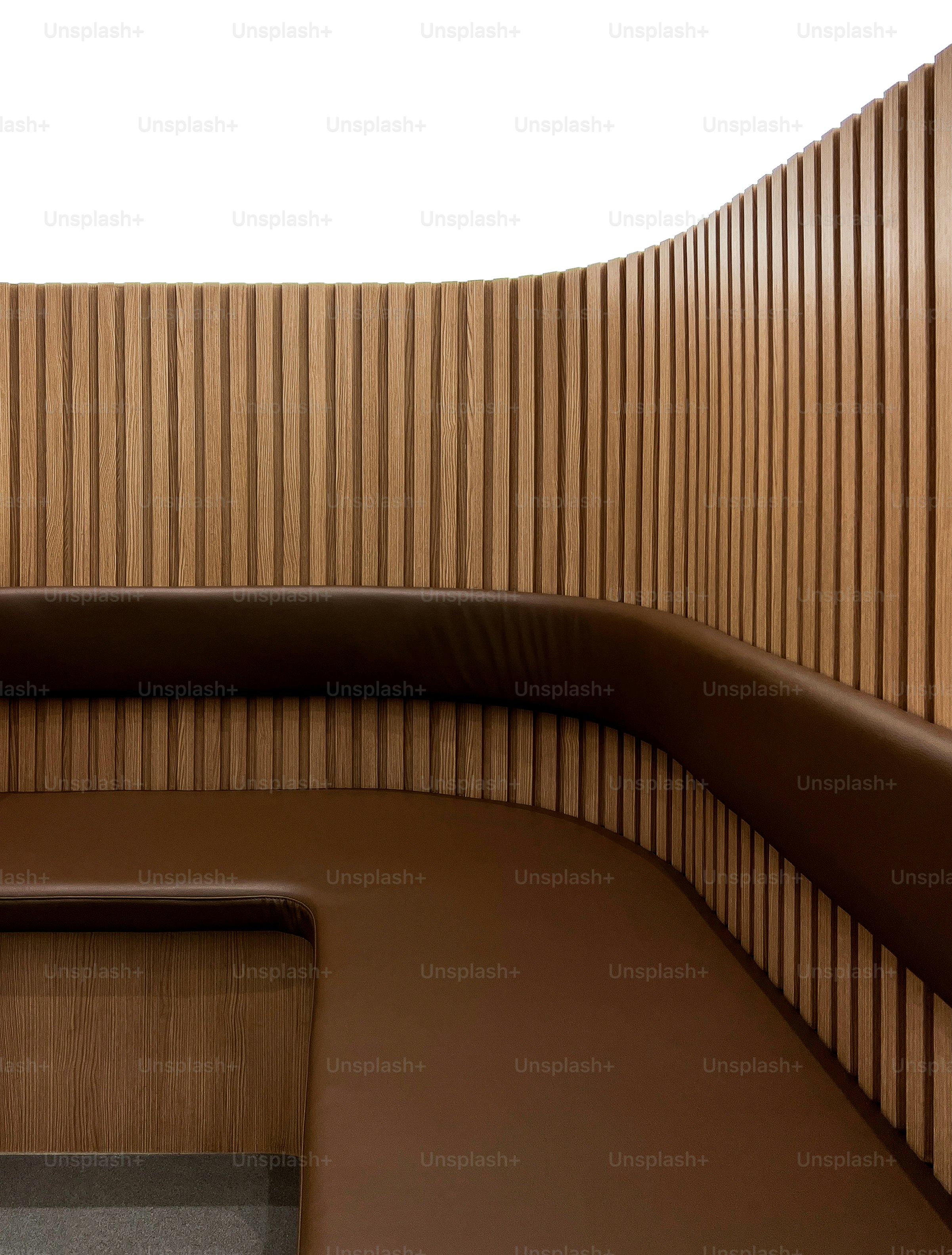 A brown bench sitting next to a wooden wall photo – Texture Image on ...