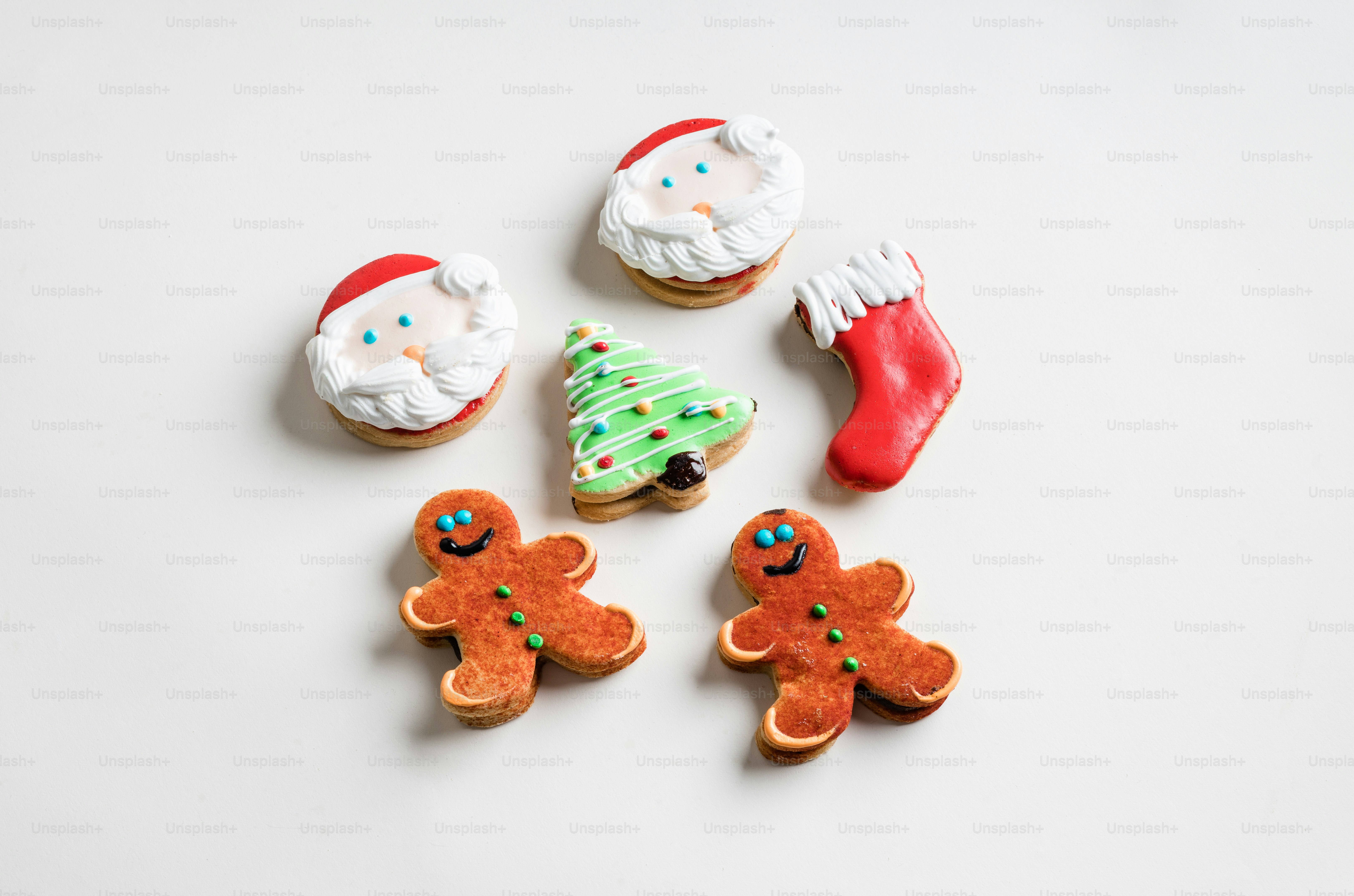 A group of decorated cookies sitting on top of a table photo – Cookies ...
