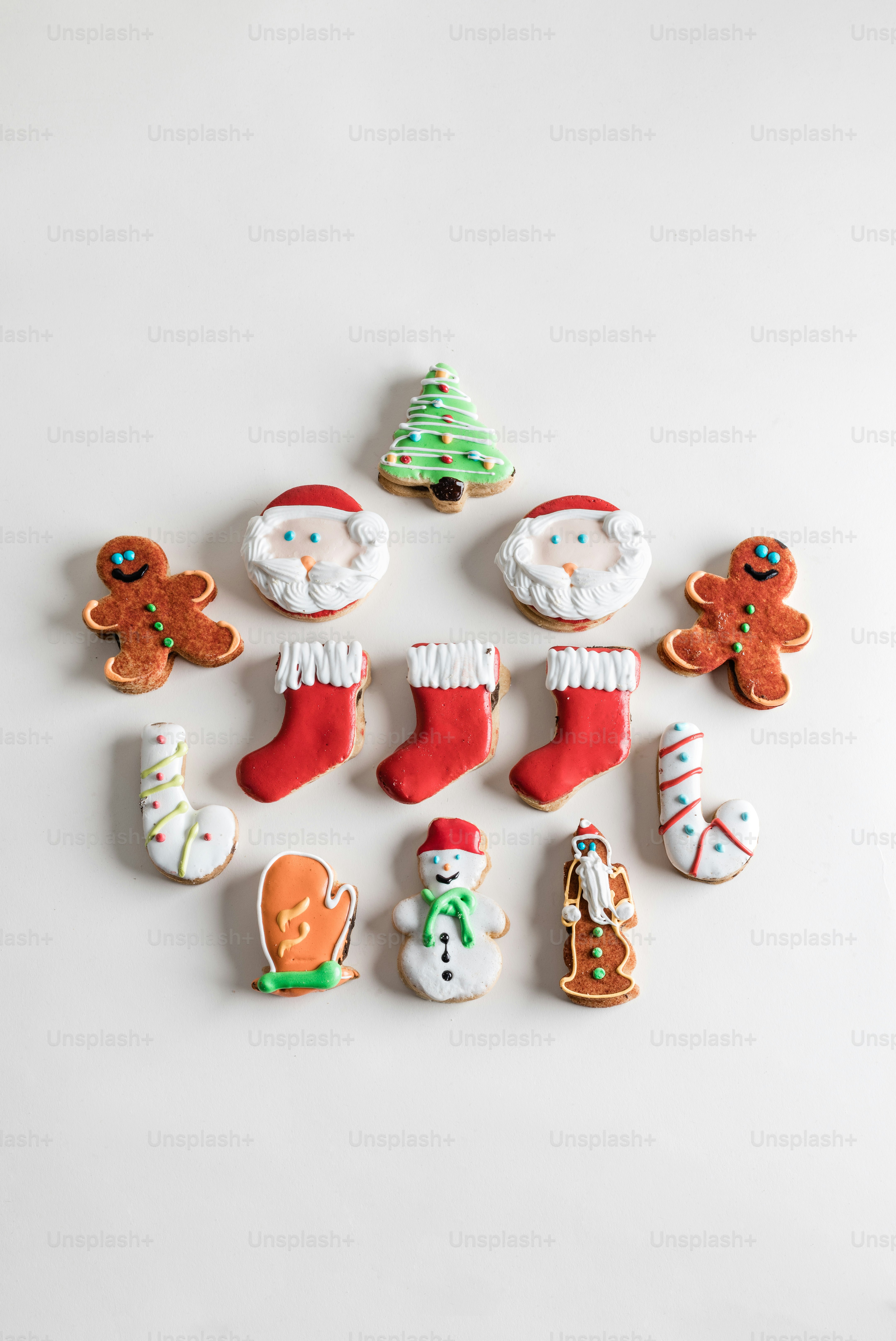 A white table topped with lots of decorated cookies photo – Cookies ...