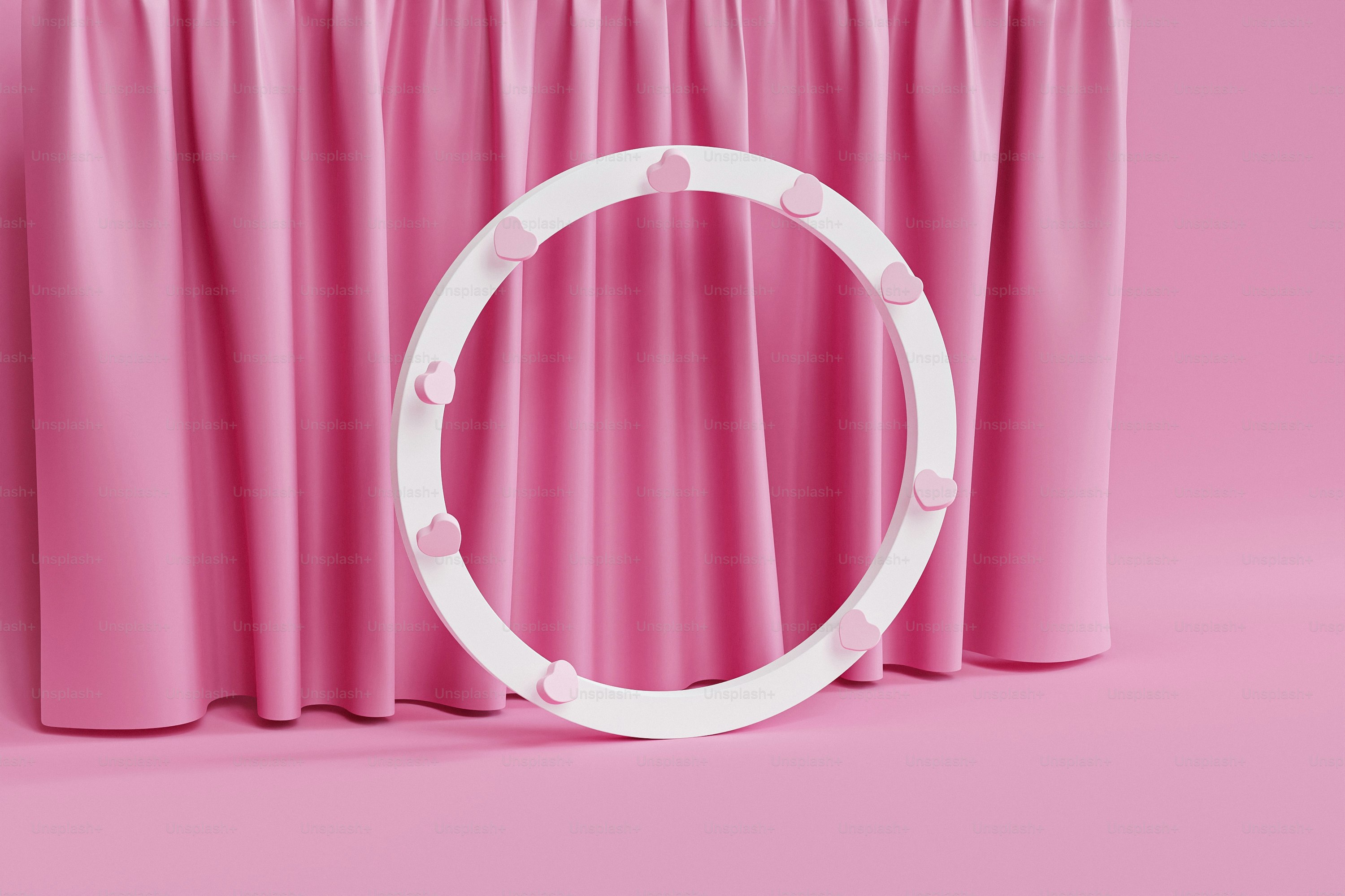 A pink curtain with a white circle on it photo – Ukraine Image on Unsplash