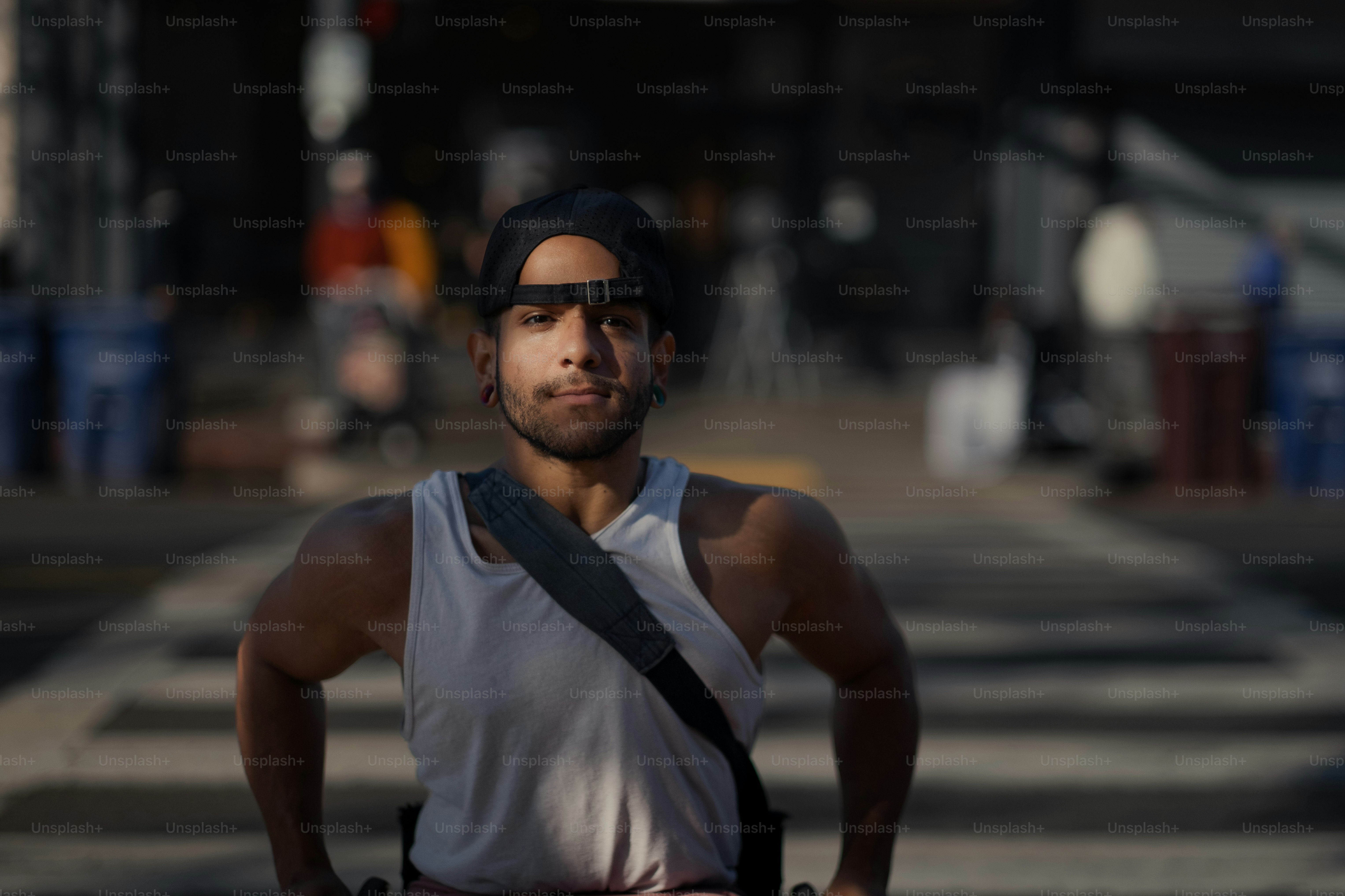 A man with a camera strapped around his neck photo – Differently abled ...
