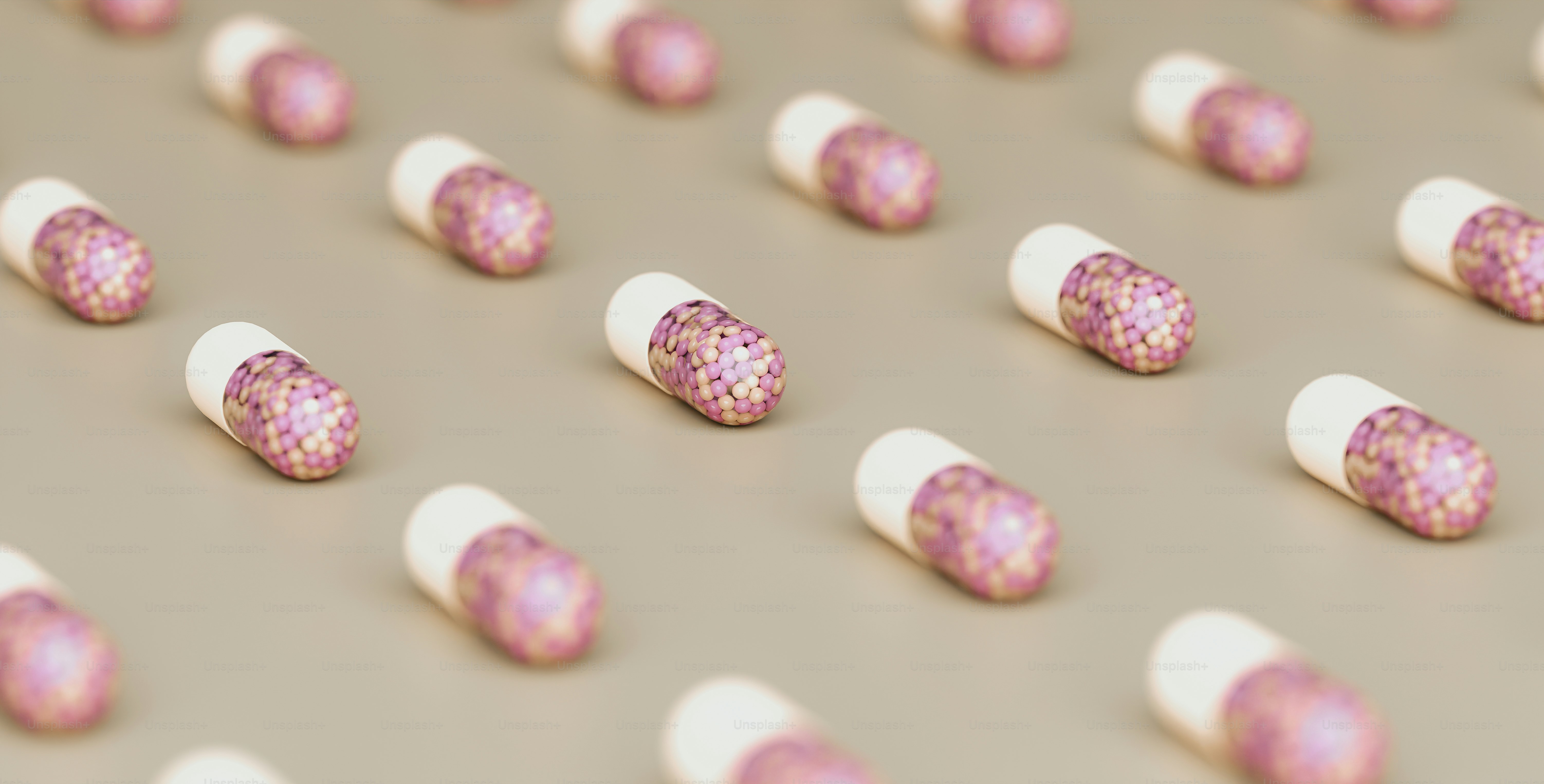A pile of pills sitting on top of a table photo – 3d Image on Unsplash