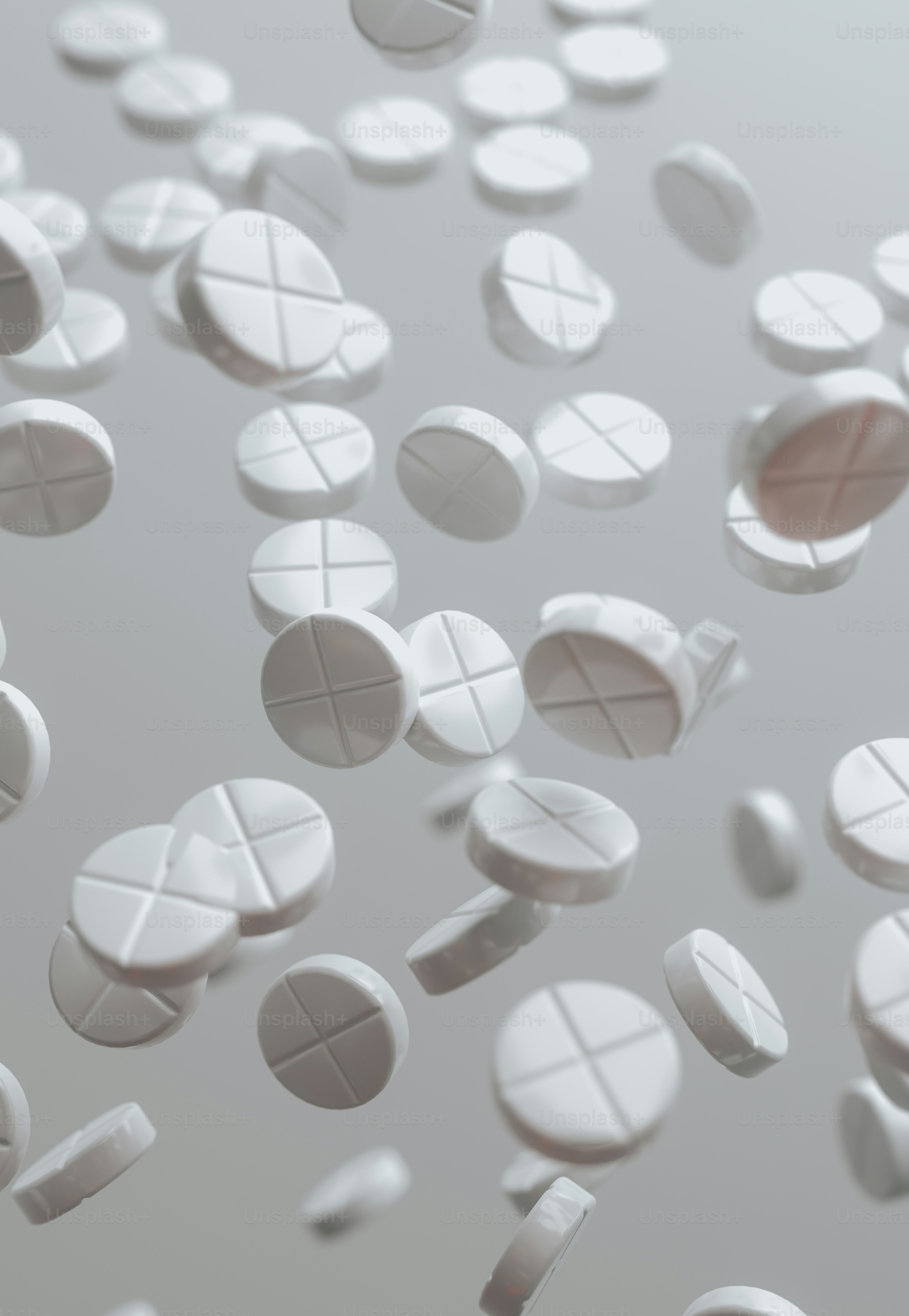 A lot of white pills floating in the air photo – Wallpaper Image on ...