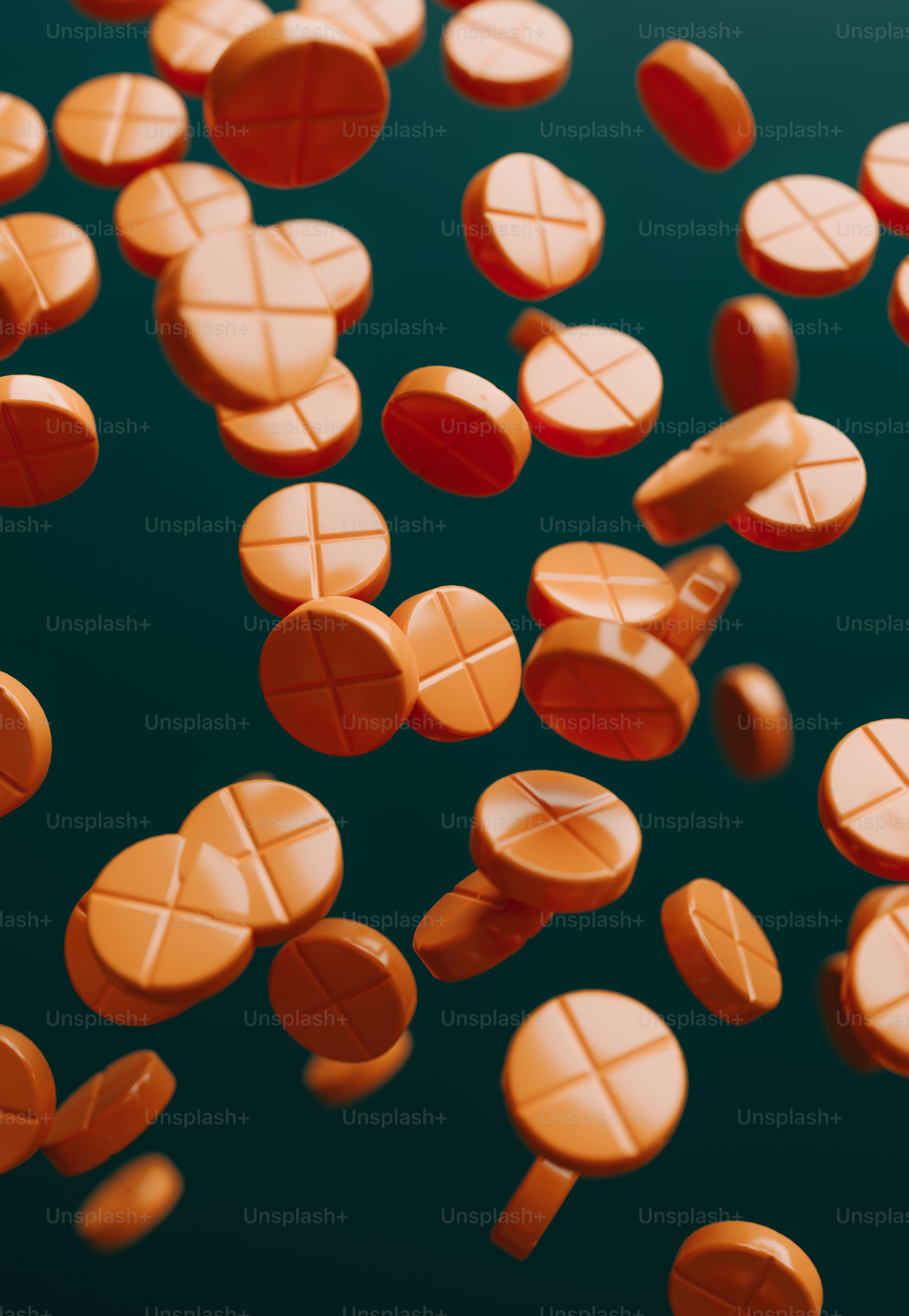 A group of orange pills floating in the air photo – Tablets Image on ...