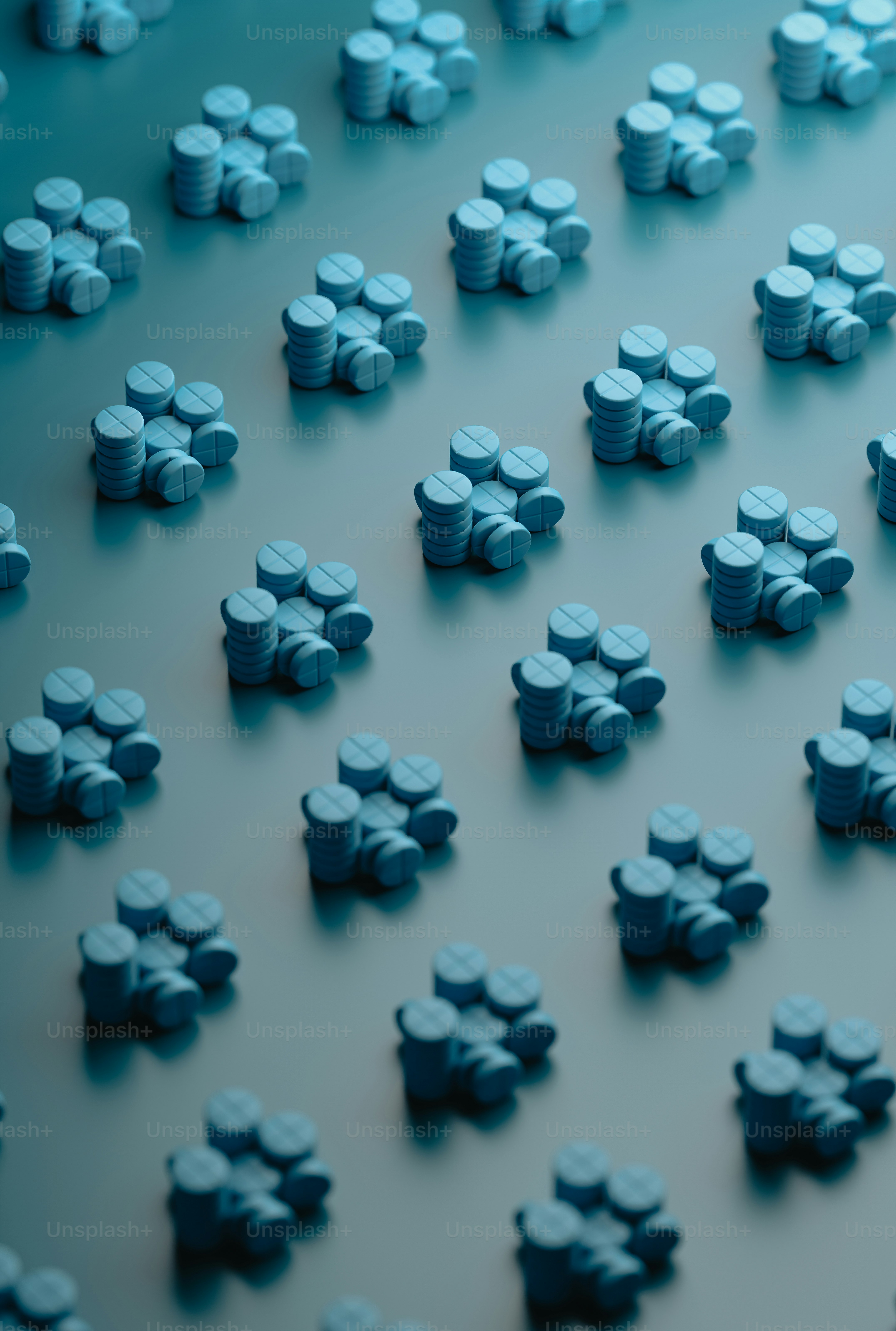 A large group of small blue objects on a table photo – Blue Image on ...