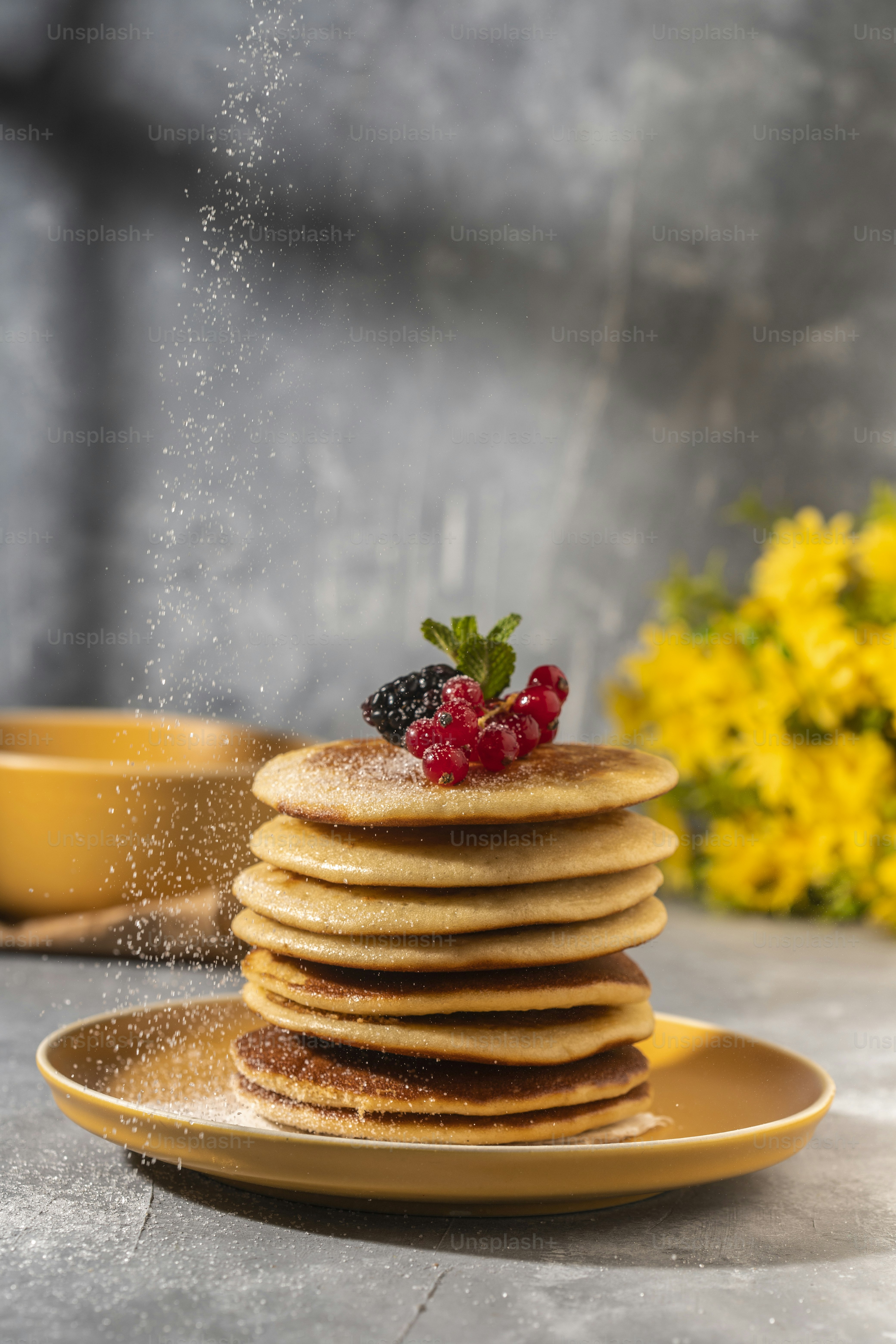 A stack of pancakes topped with berries and syrup photo – Fruit Image ...