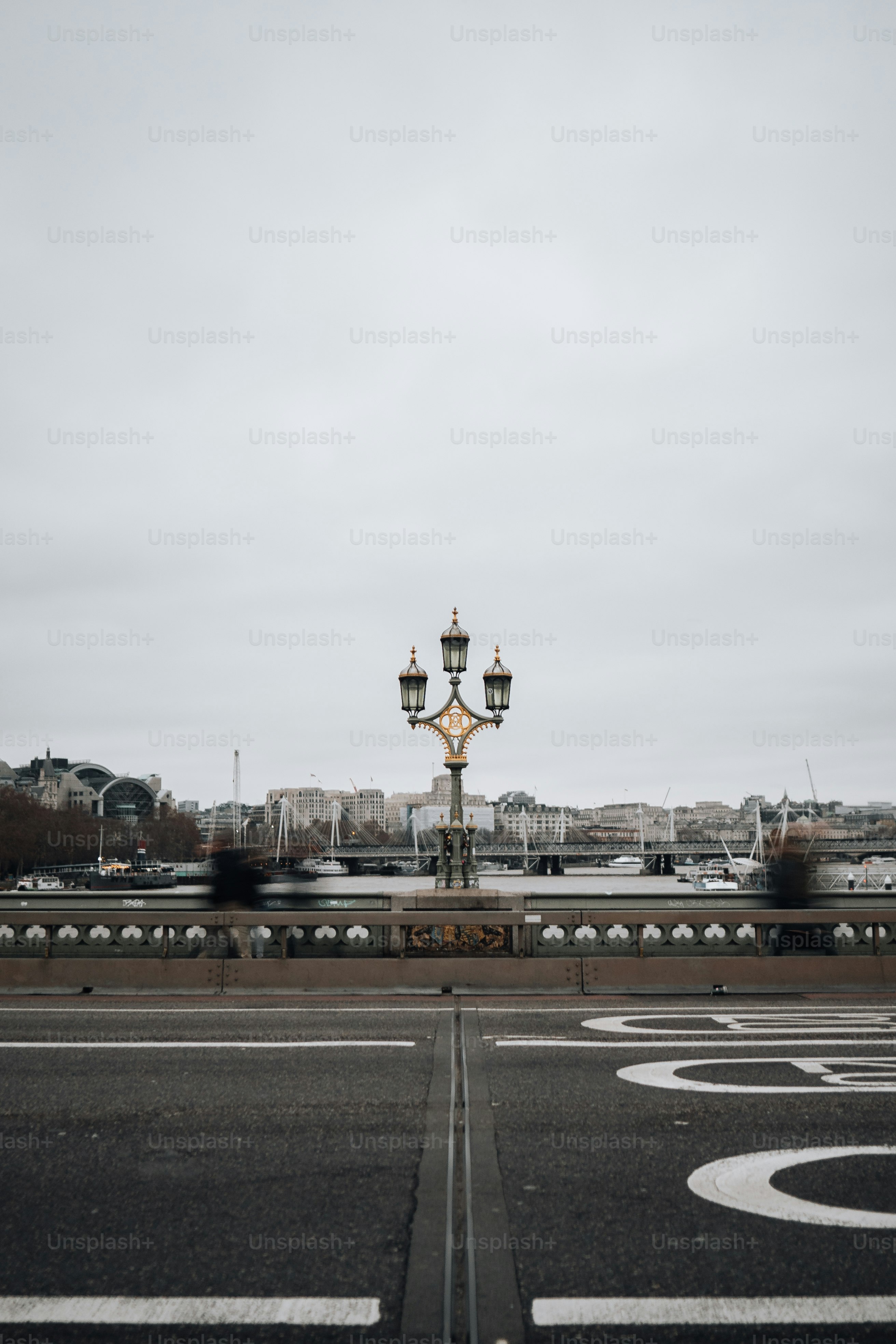 A street light sitting on the side of a road photo – London Image on ...