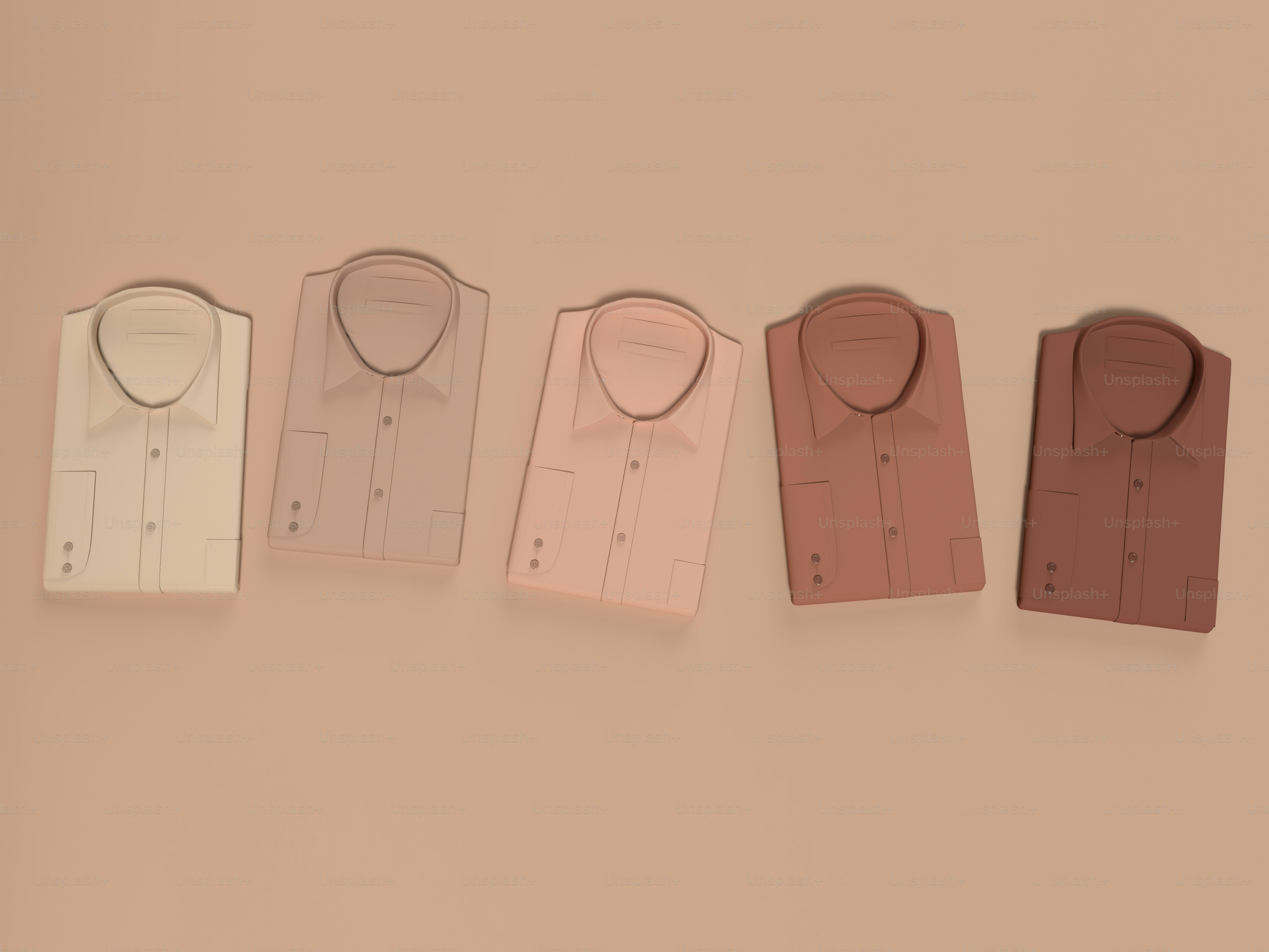 A group of five different colored shirts hanging on a wall photo ...