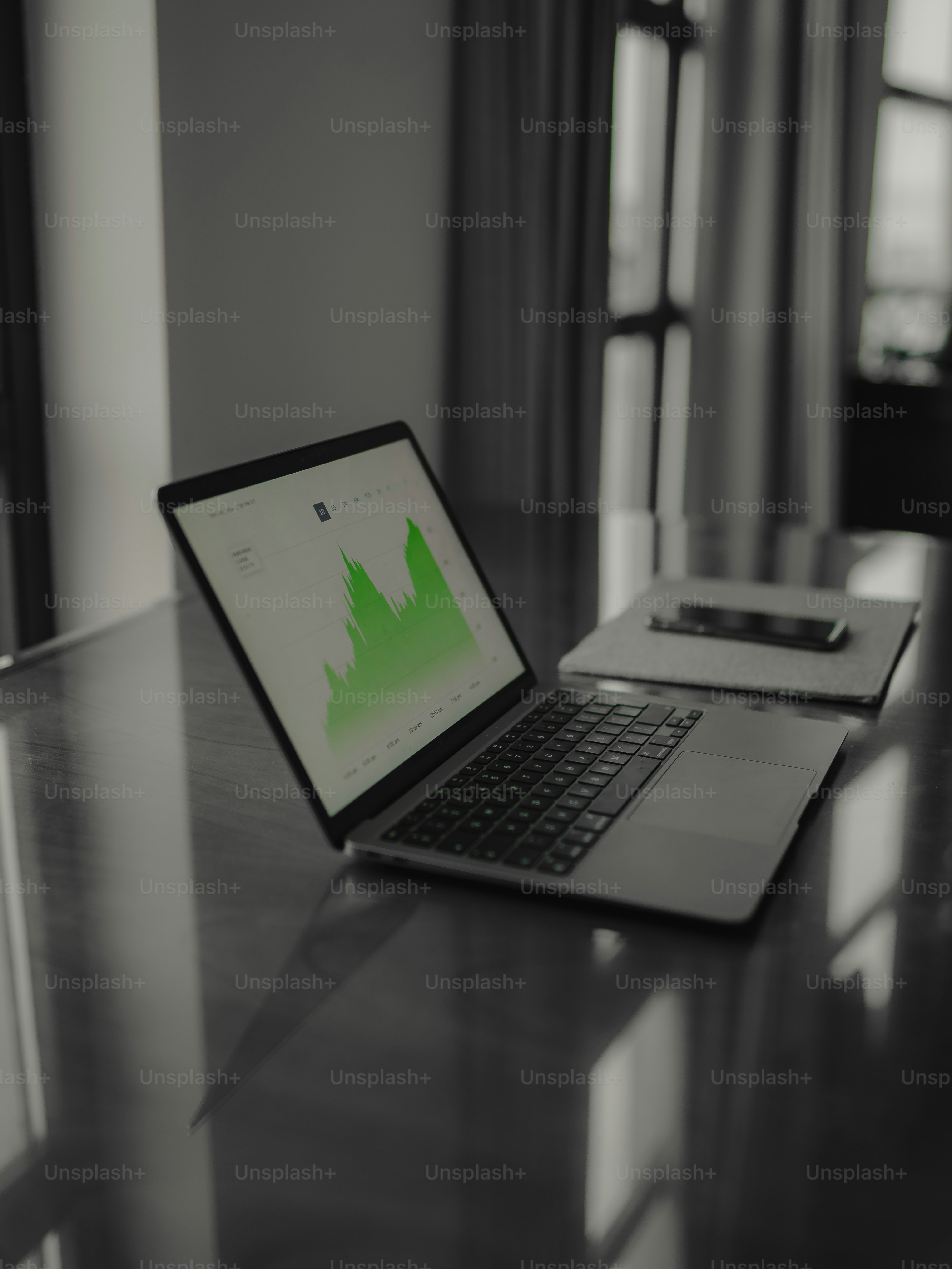 A laptop computer sitting on top of a wooden desk photo – Laptop Image ...
