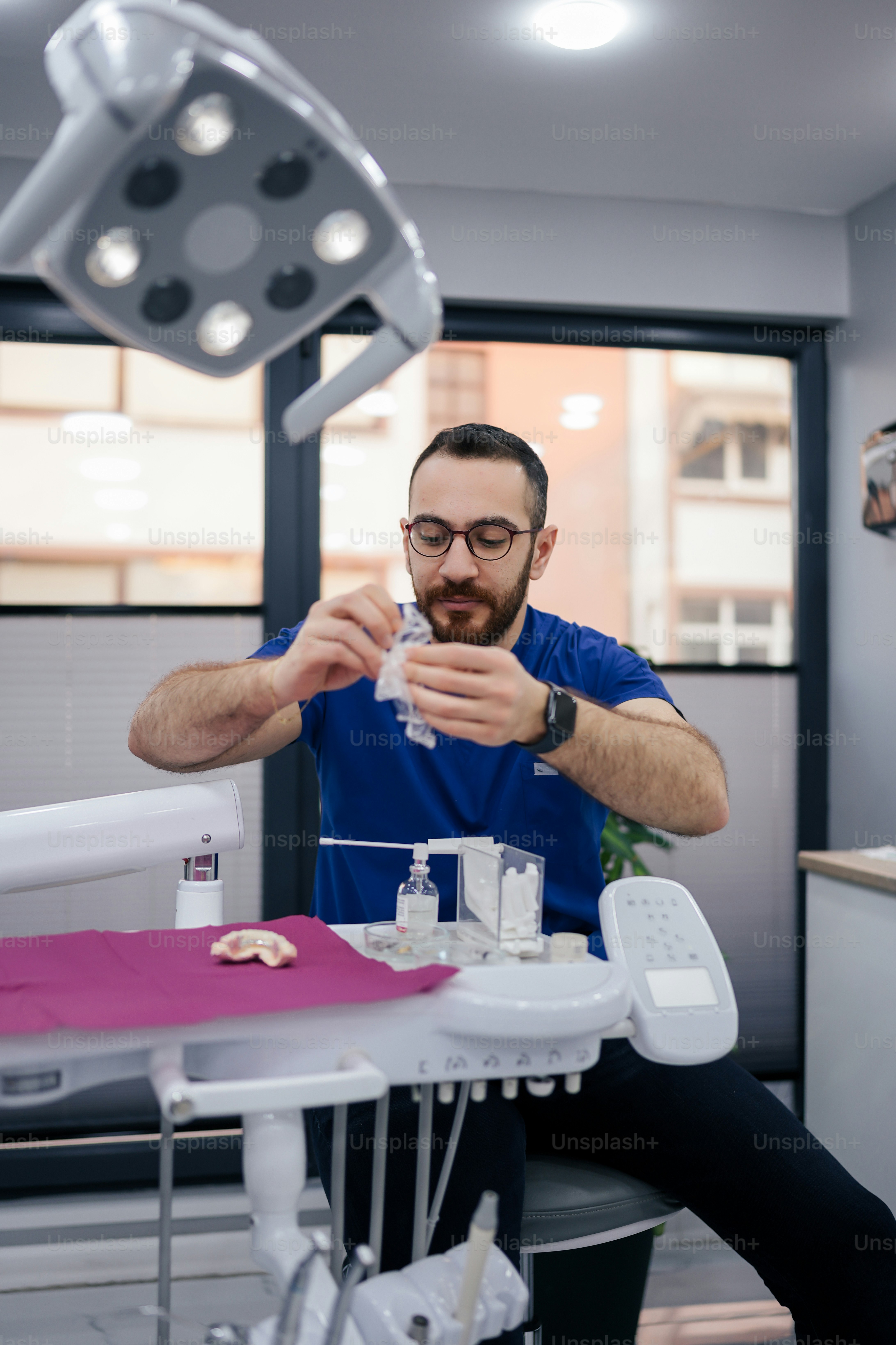 A group of dental instruments sitting on top of a table photo – Dentist ...