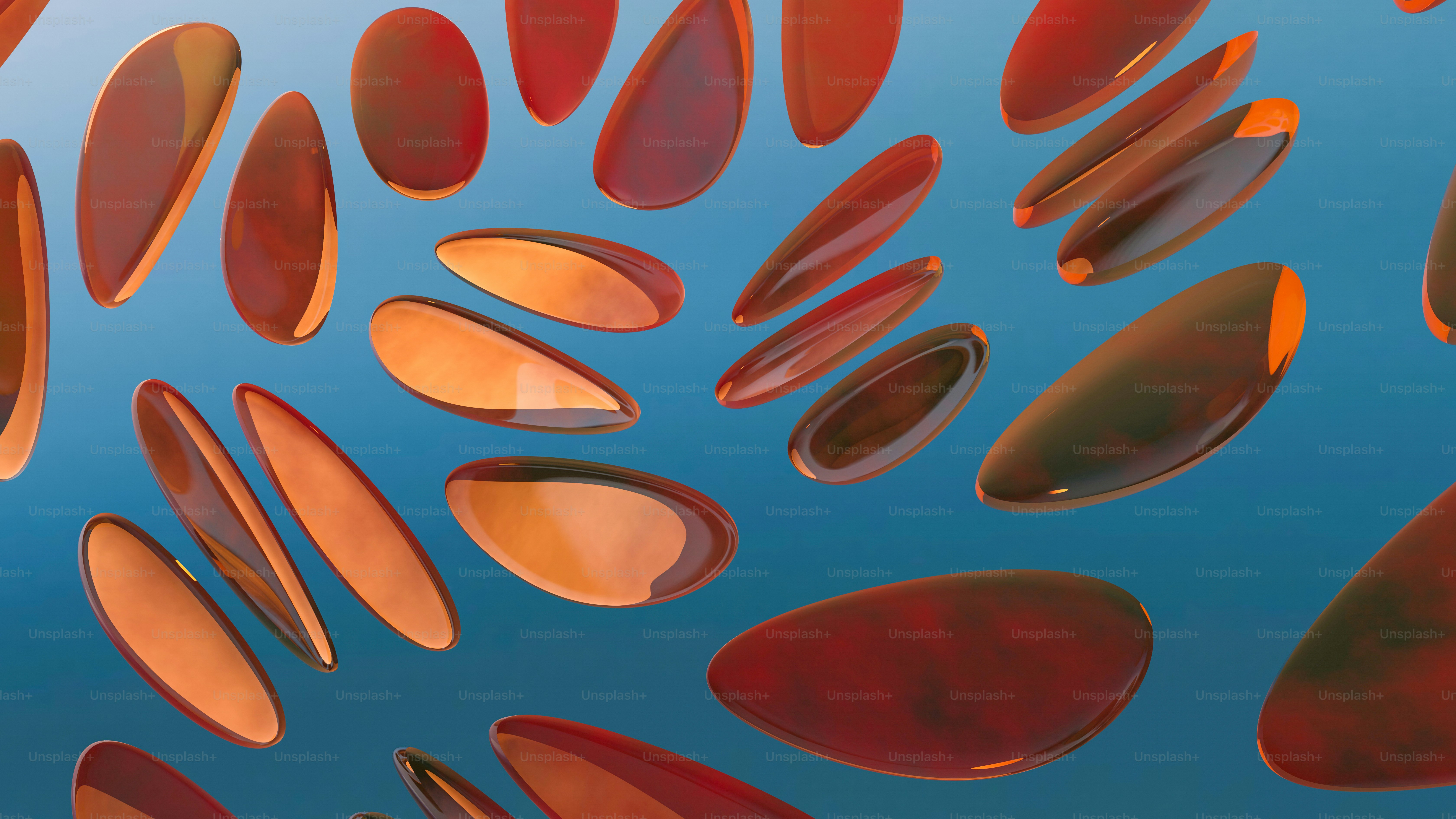 A group of red and orange objects floating in the air photo – Modern ...