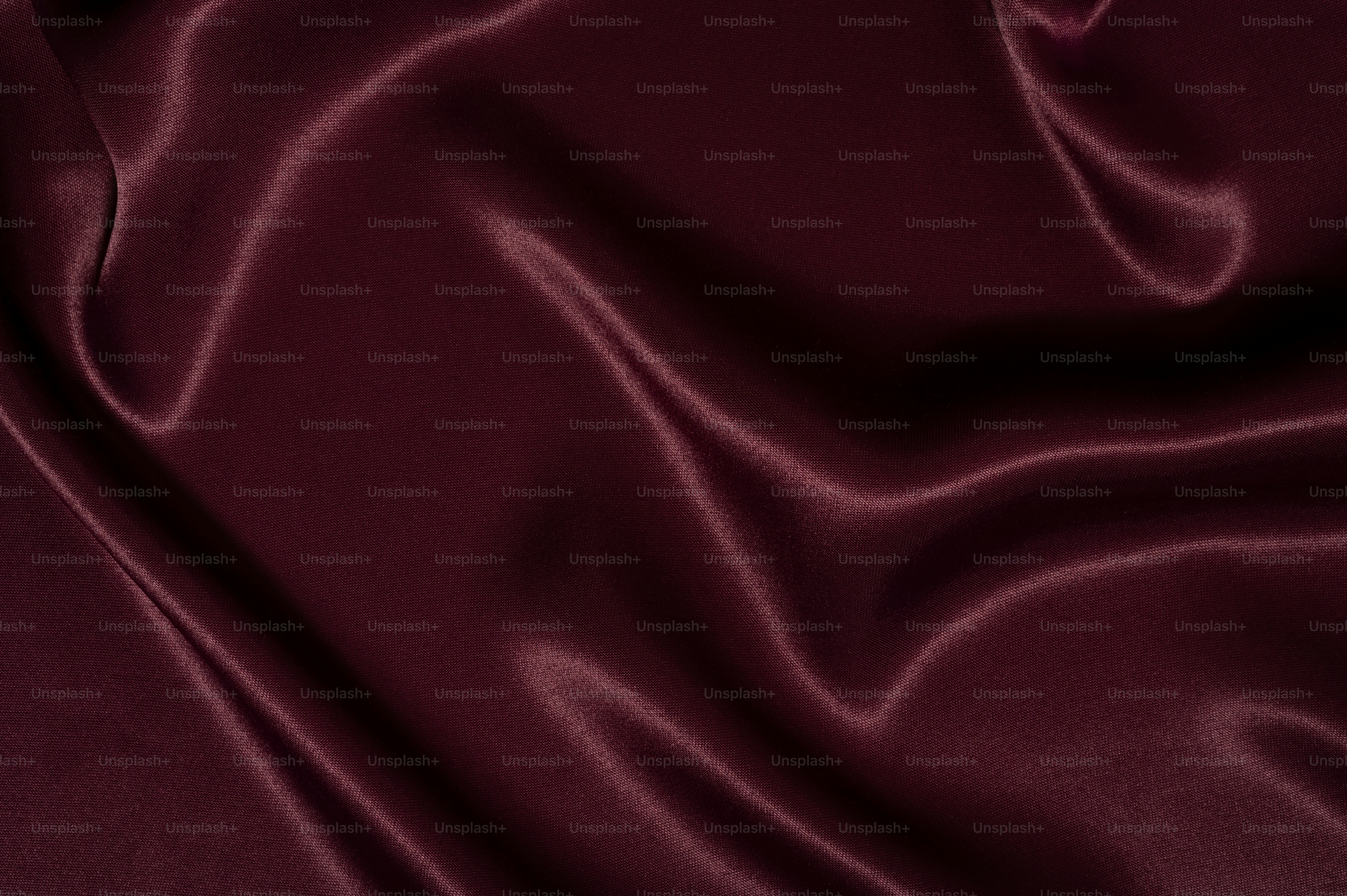 A close up view of a maroon fabric photo – Maroon colour Image on Unsplash