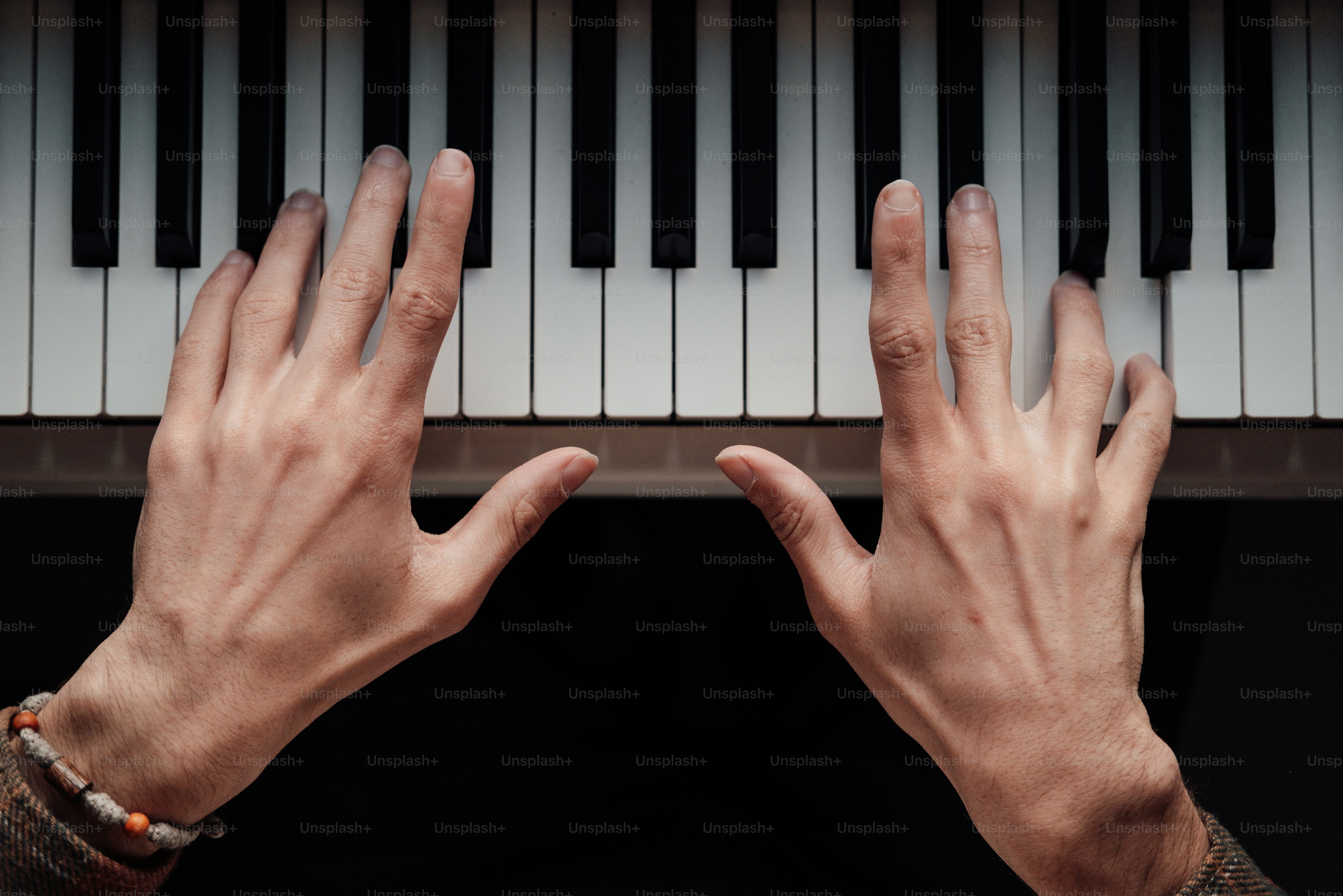 A person's hands reaching for a piano keyboard photo – Playing music ...