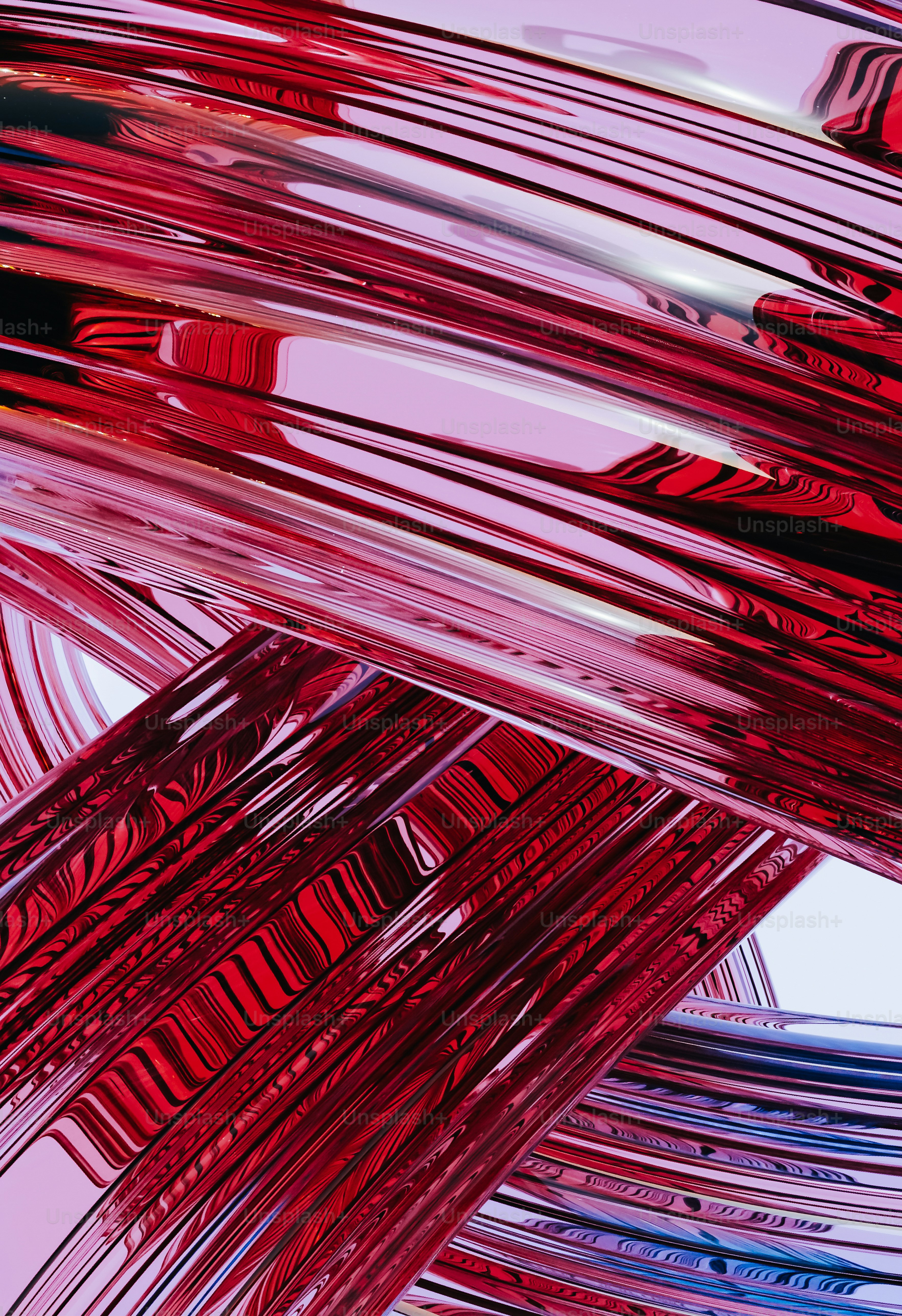 A close up of a red and blue object photo – Glass art Image on Unsplash