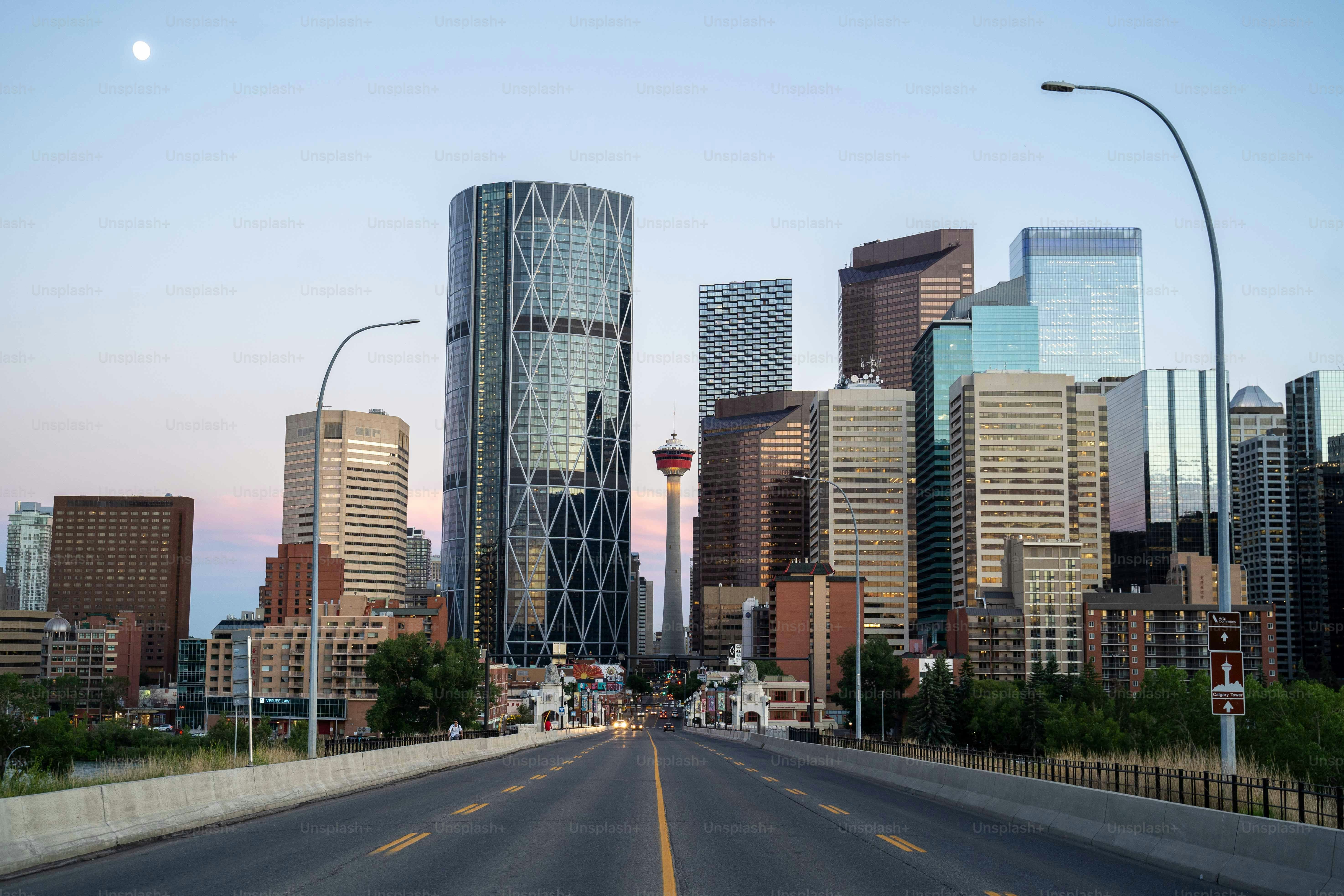 A view of a city with tall buildings photo – Alberta canada Image on ...
