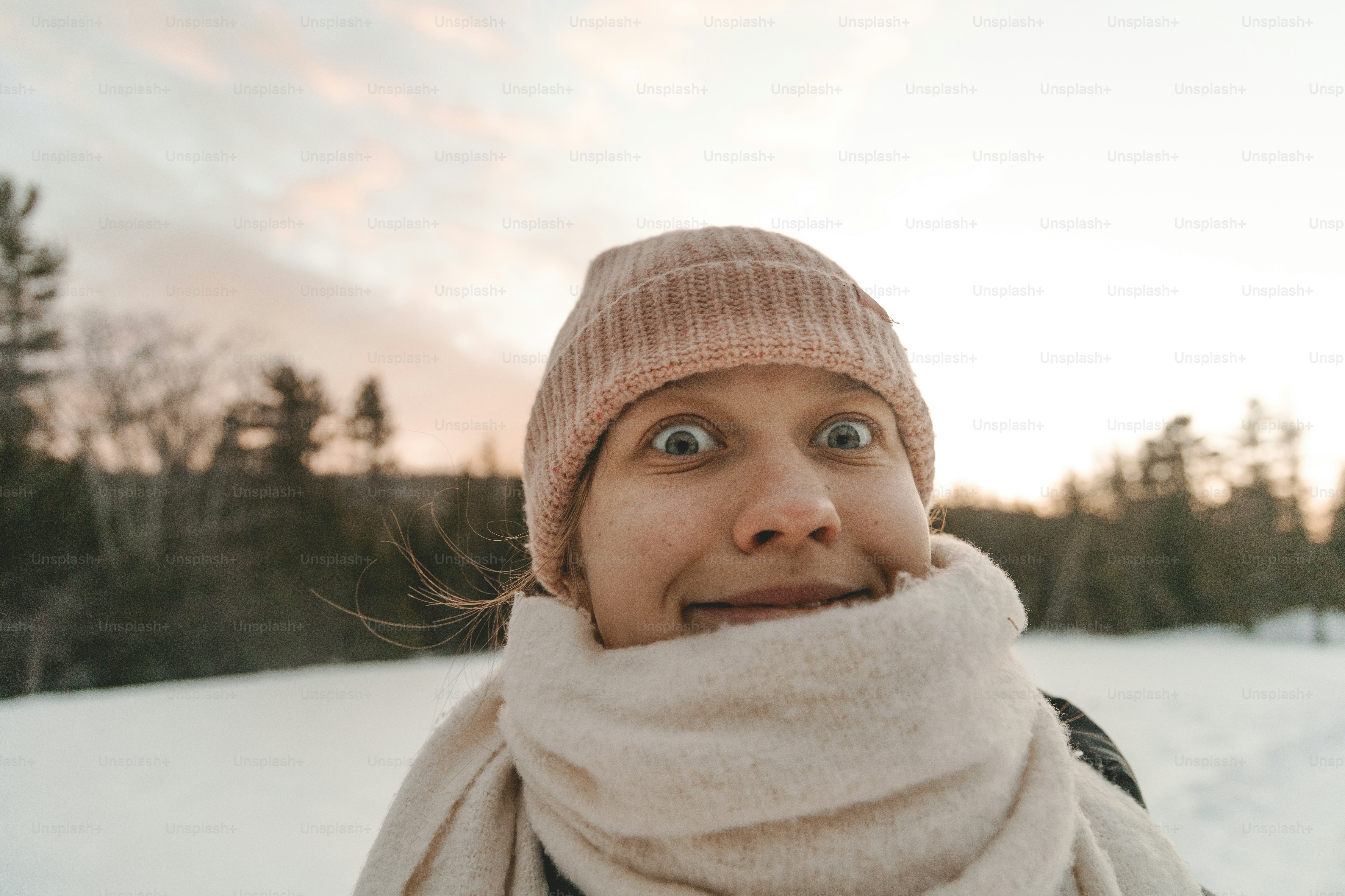 A woman with a scarf around her neck in the snow photo – Hat Image on ...