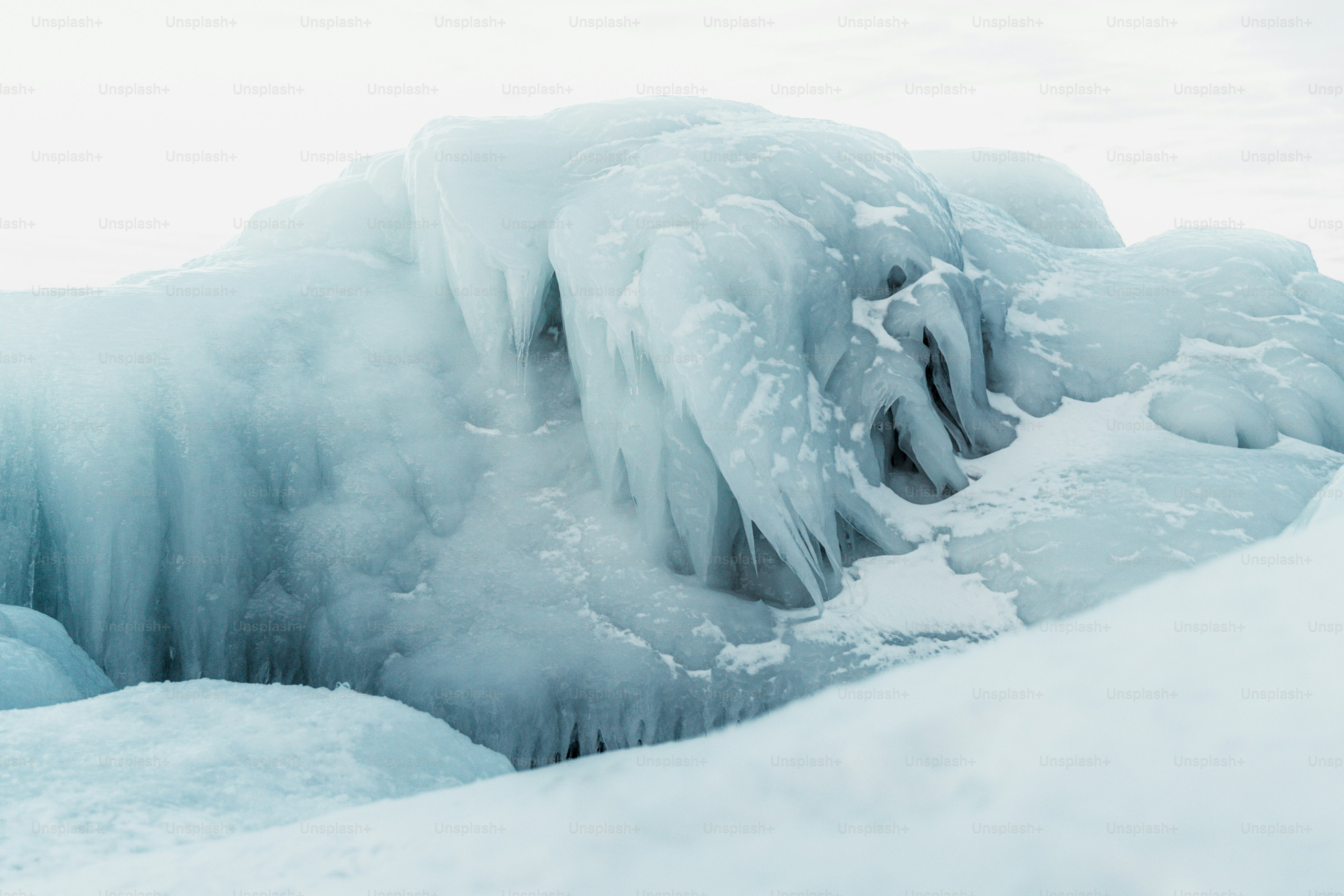 A very large ice formation in the snow photo – Winter Image on Unsplash
