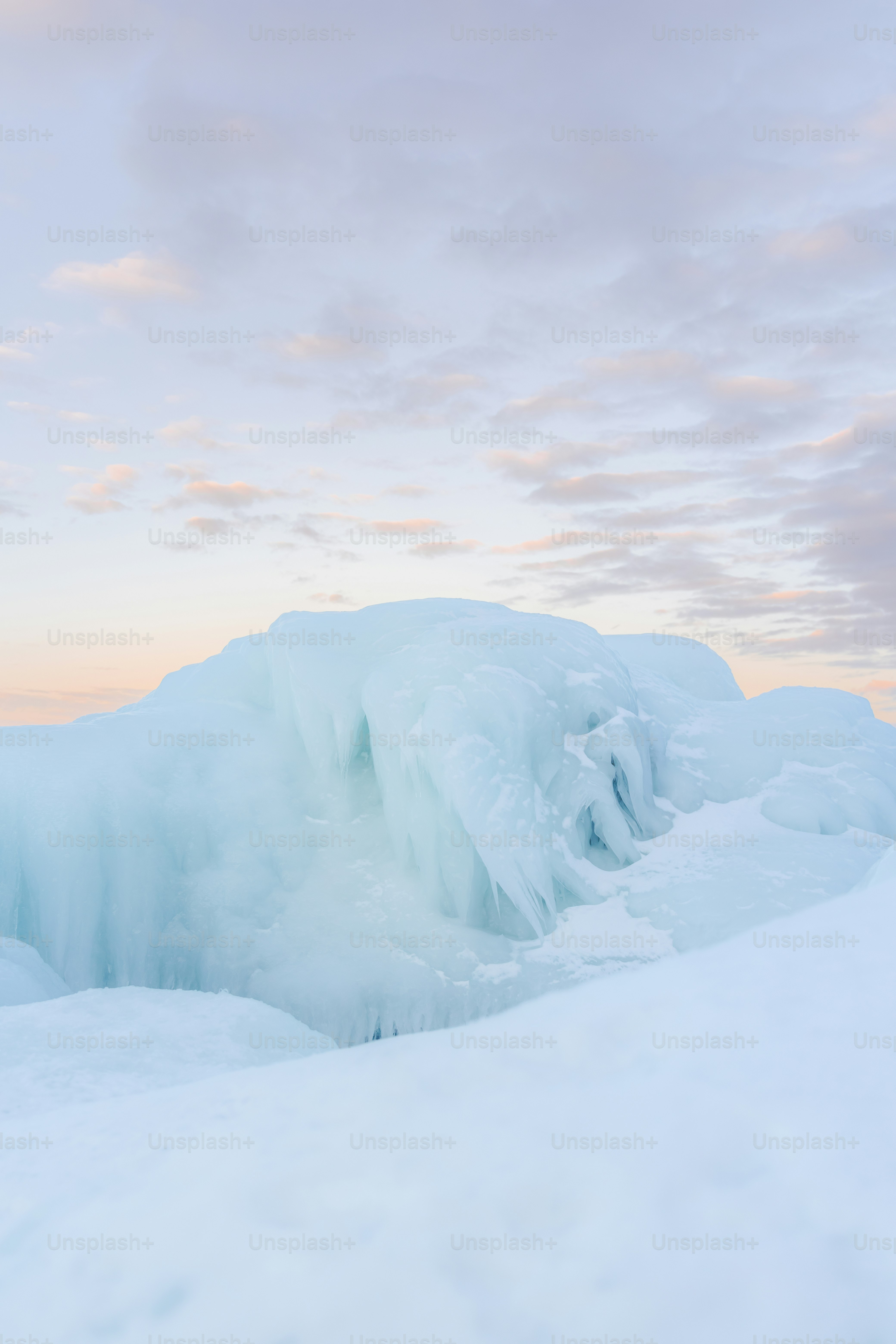 A very large iceberg in the middle of a snowy field photo – Nature ...