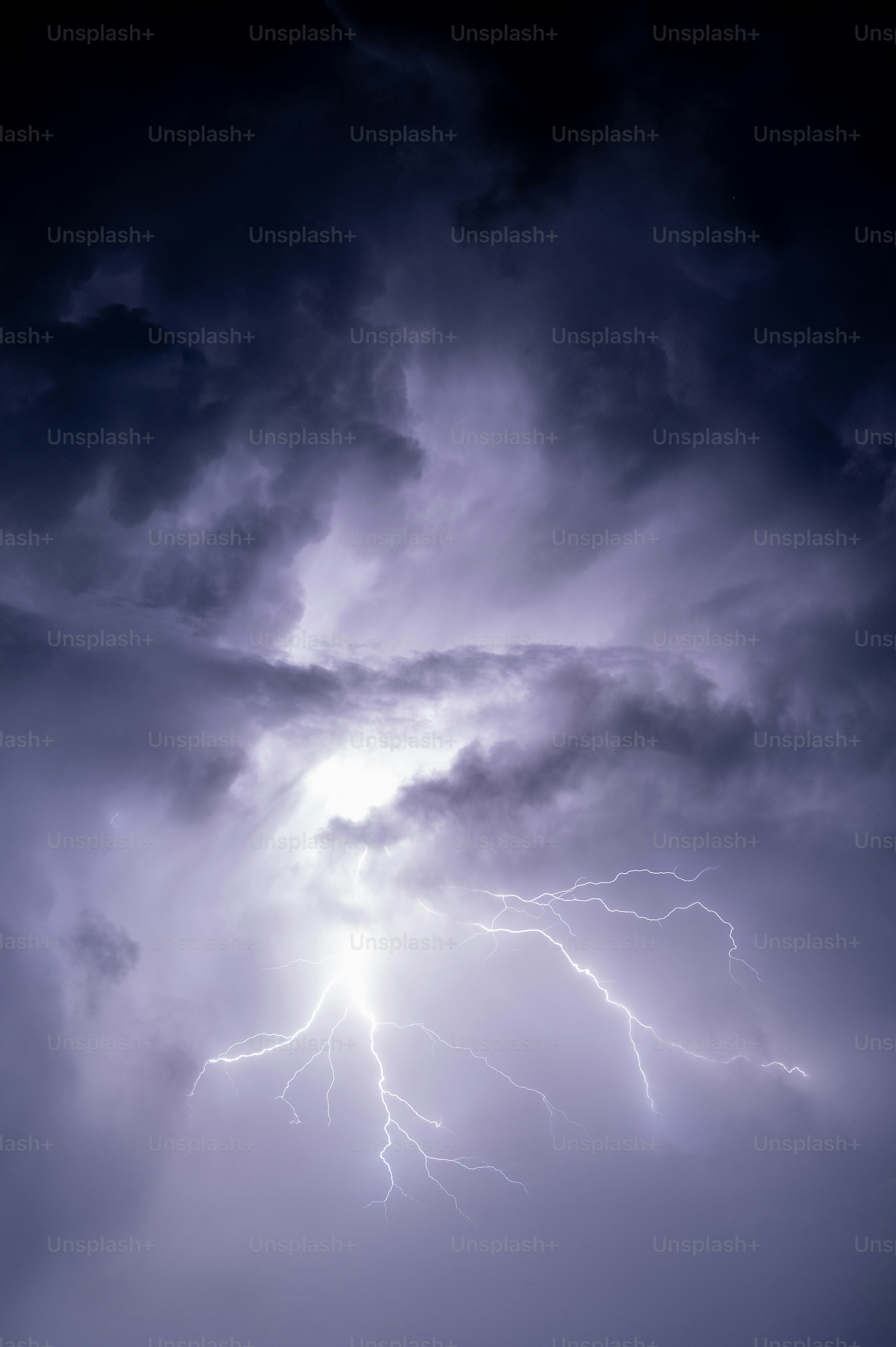 A large cloud with a lightning bolt in the sky photo – Lightening Image ...