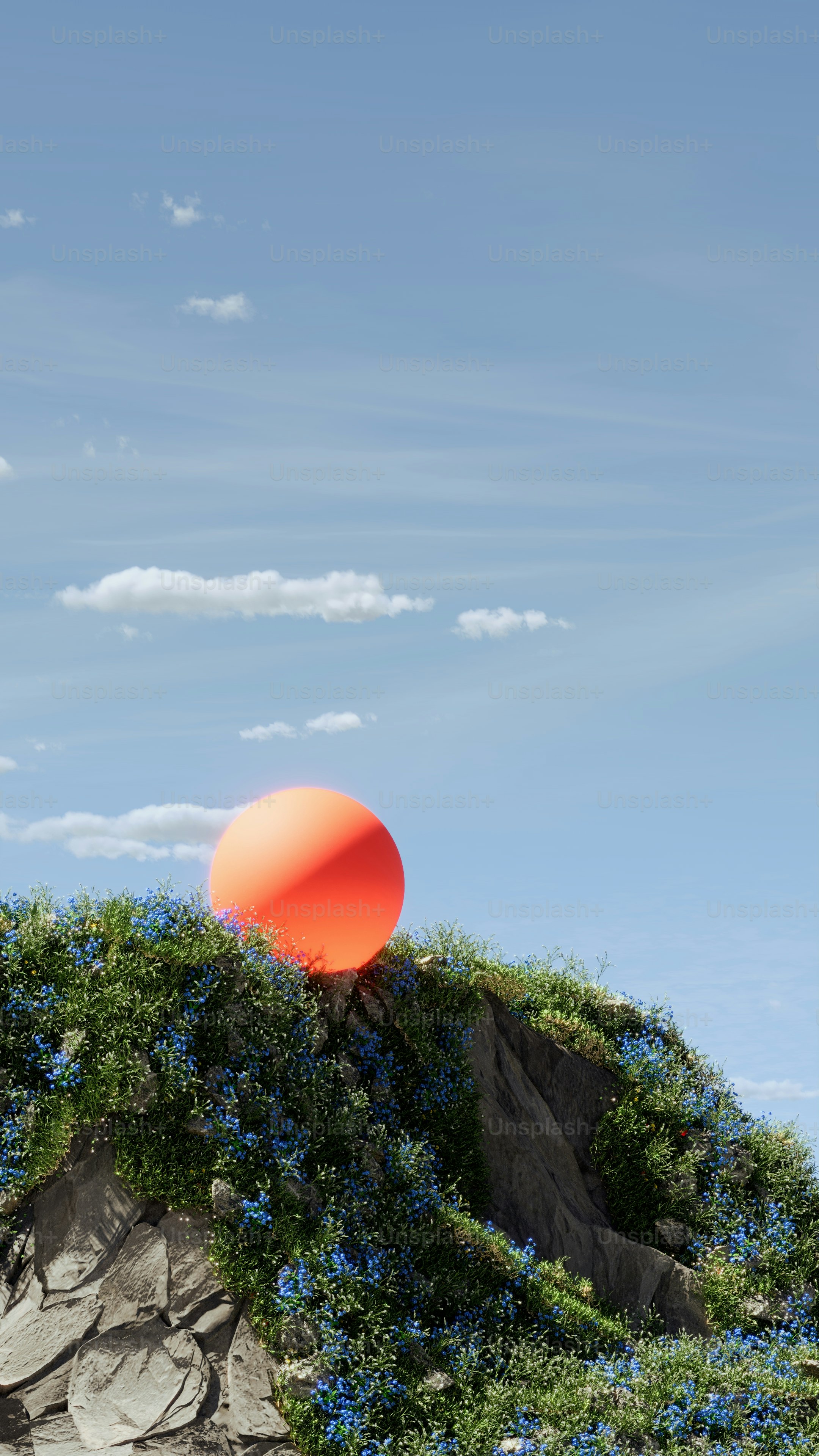 A red ball sitting on top of a lush green hillside photo – Wallpaper ...
