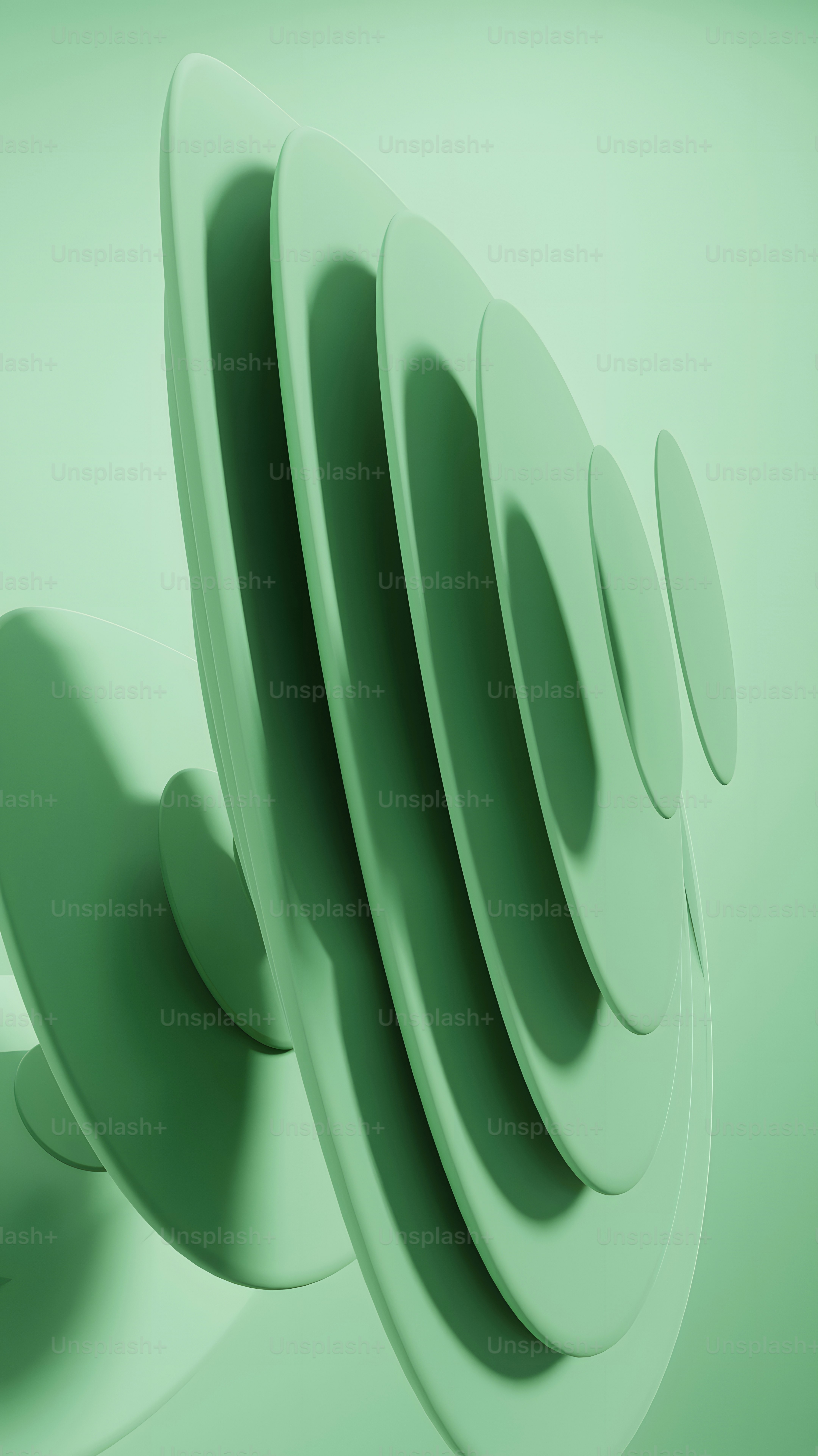 A group of circular objects sitting on top of a green surface photo ...