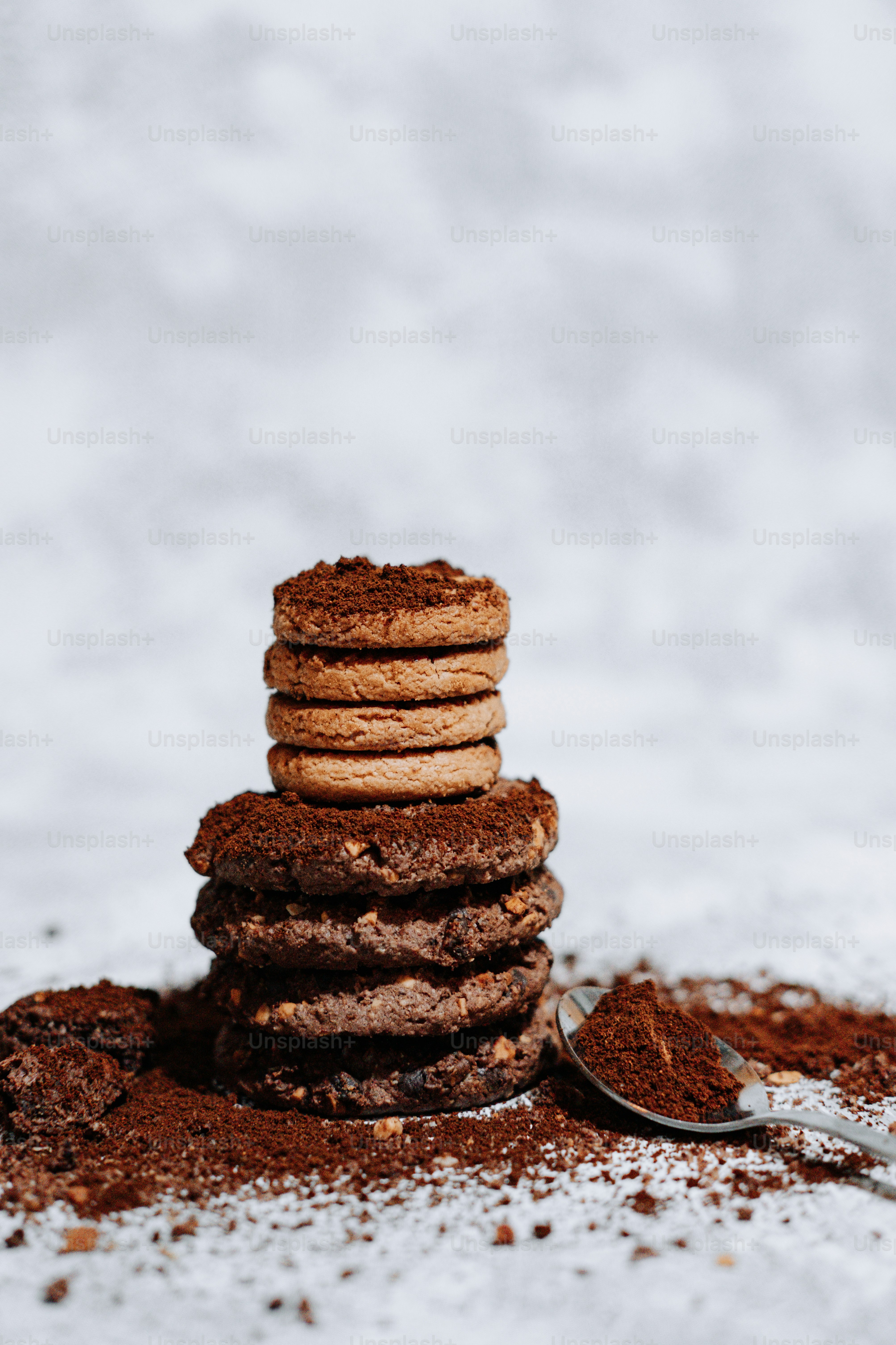 A stack of cookies sitting on top of a pile of dirt photo – Chocolate ...
