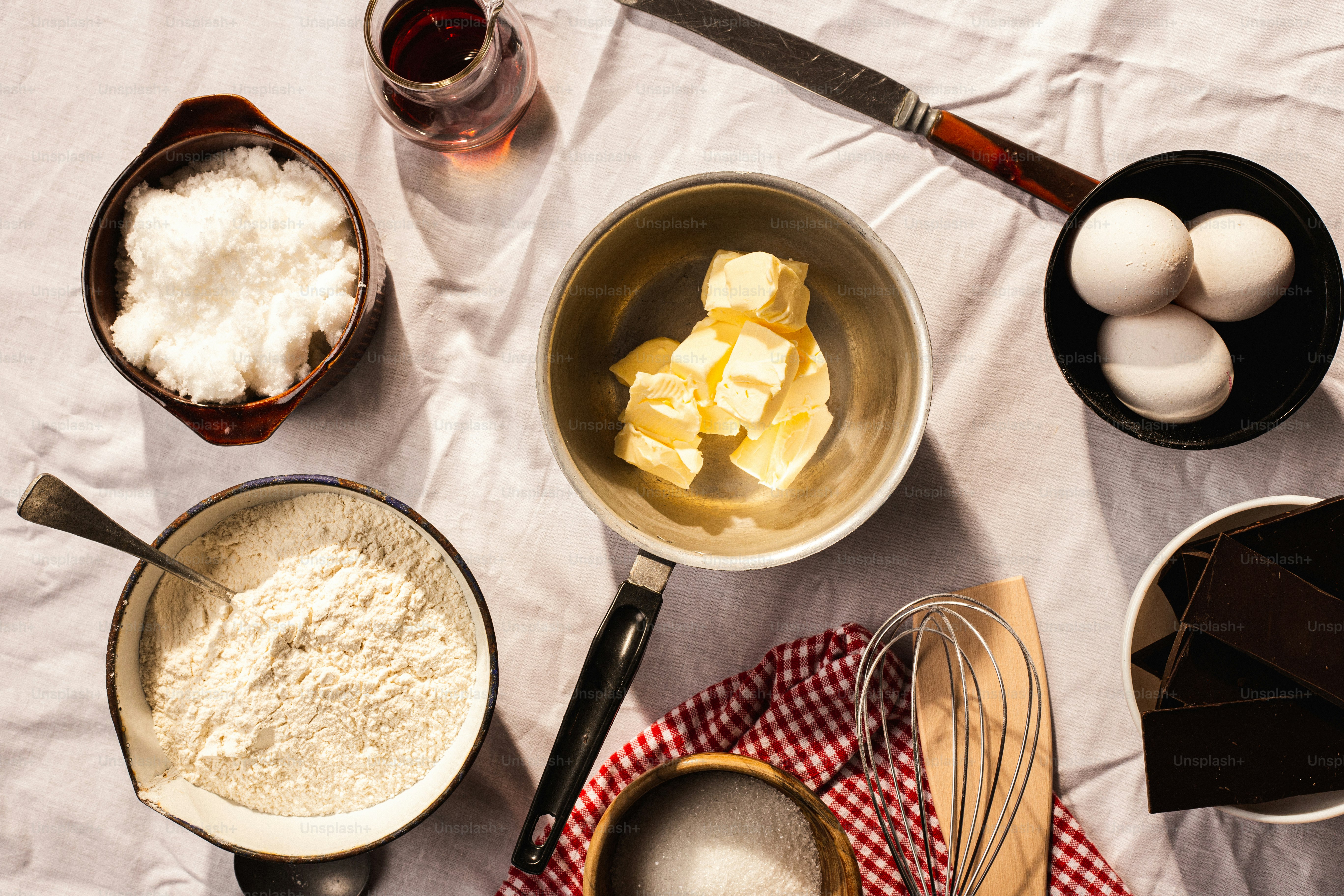 A table topped with bowls of food and utensils photo – Baking cookies ...