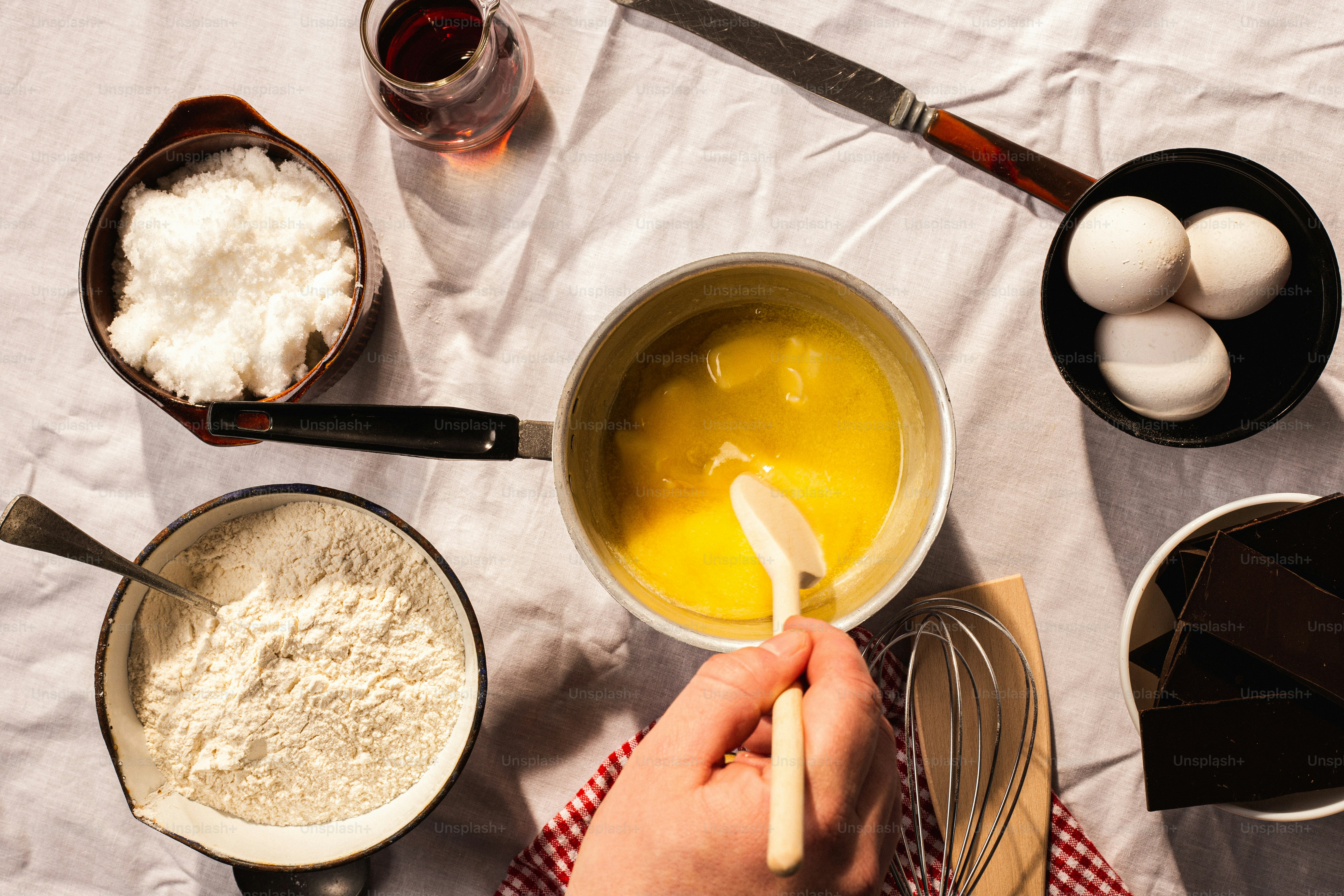 Person Mixing Ingredients In A Bowl