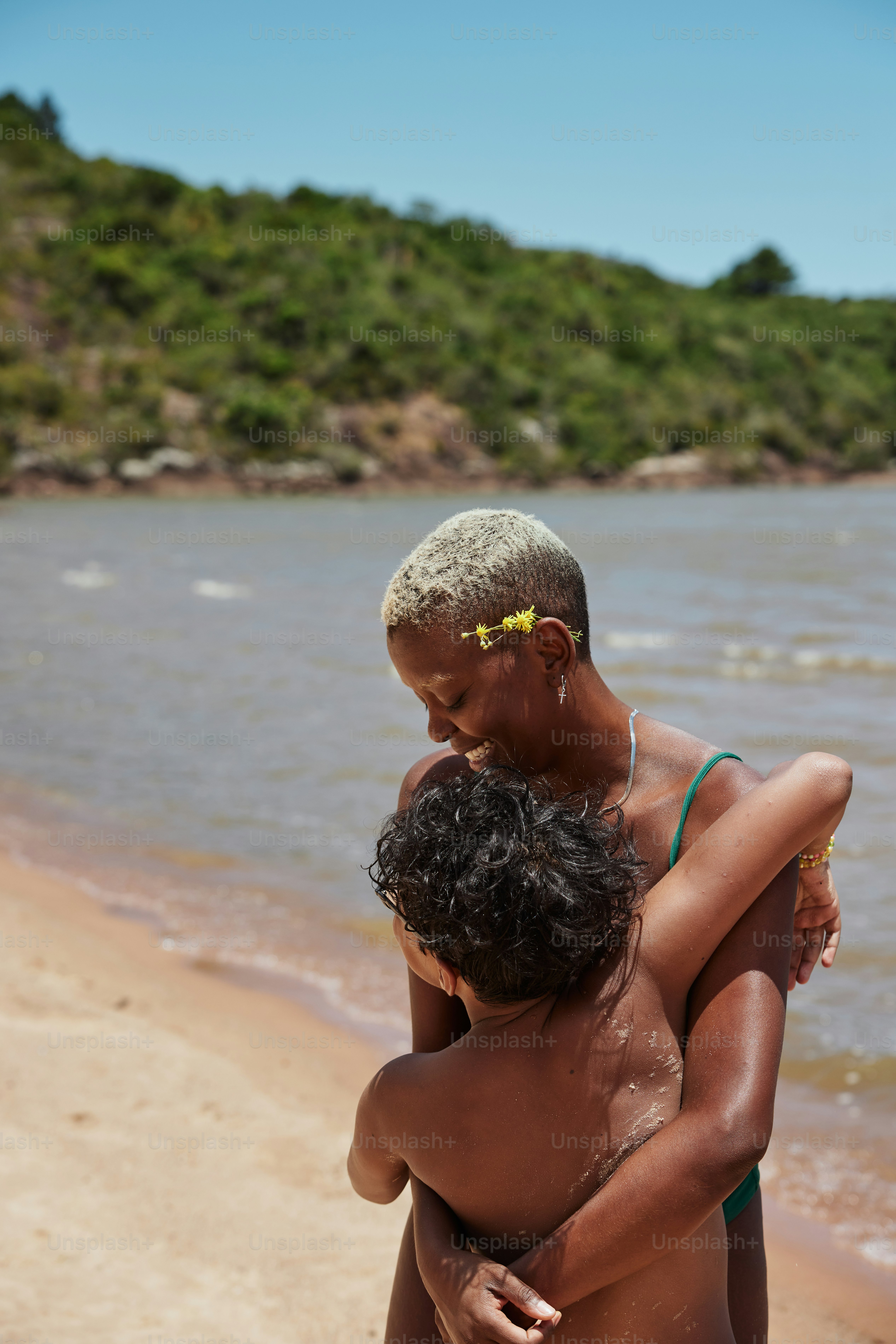 A couple of people that are standing in the sand photo – Family Image ...