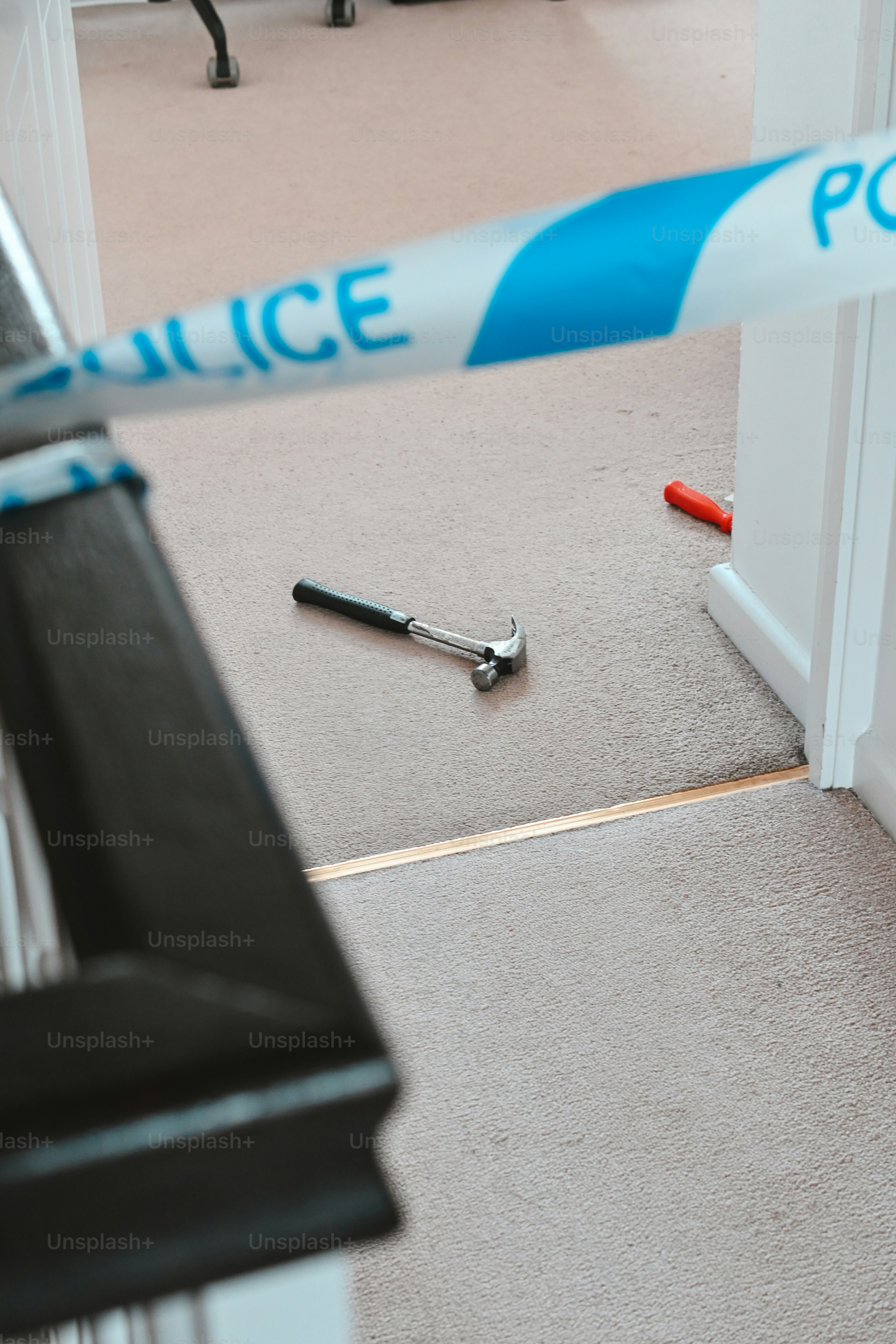 A bike tire laying on the ground next to a police pole photo – Crime ...