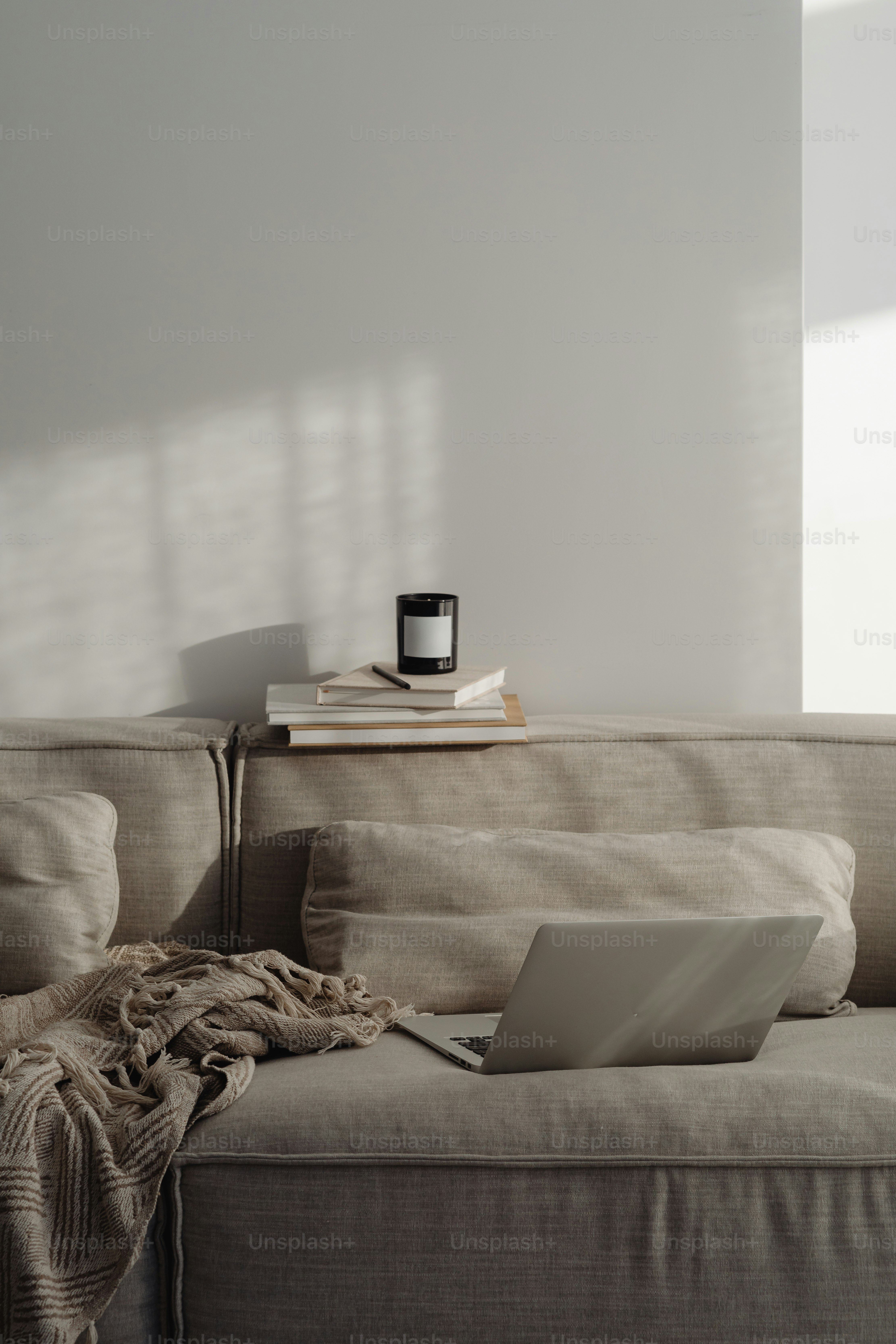 A laptop computer sitting on top of a couch photo – Books Image on Unsplash