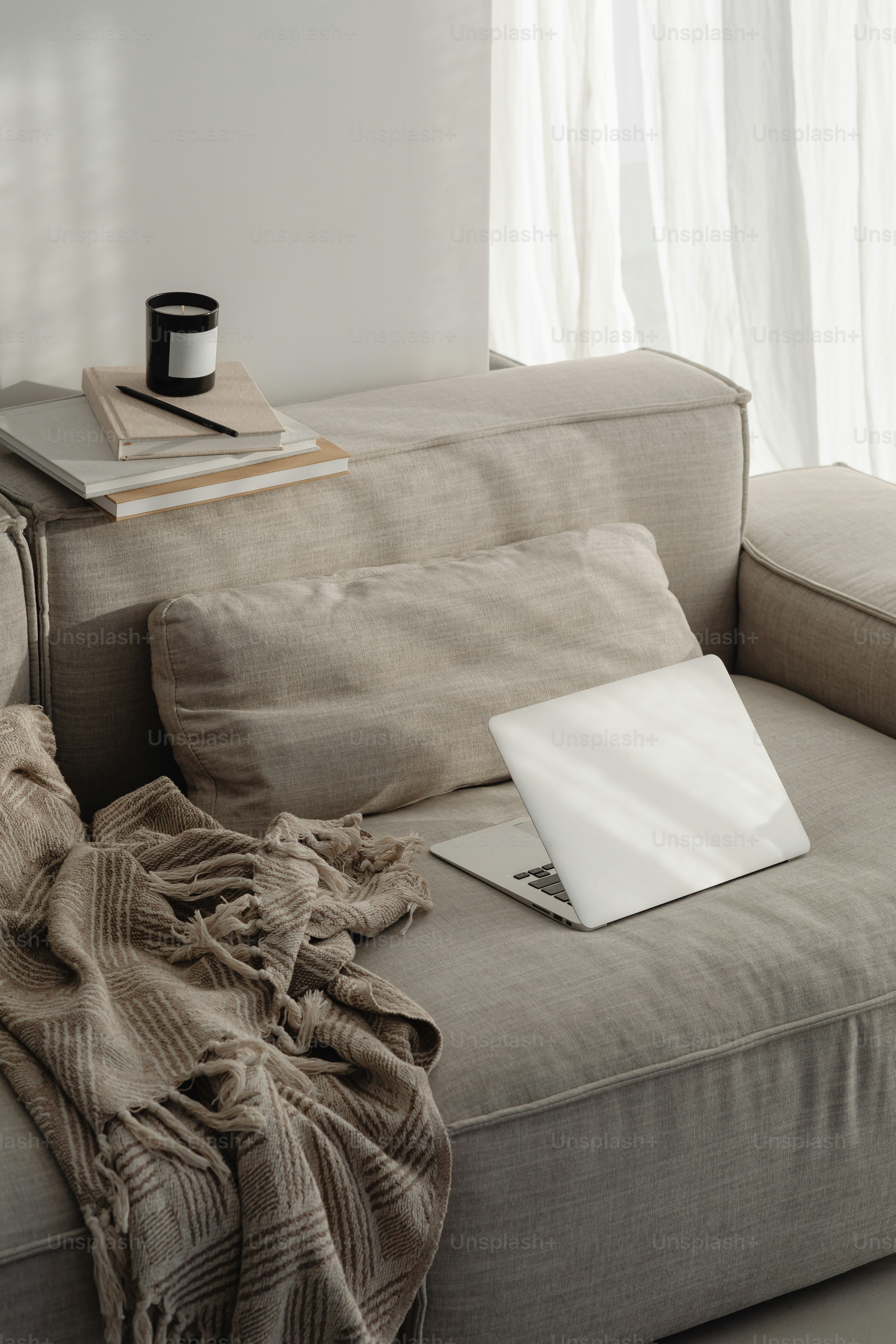 A laptop computer sitting on top of a couch photo – Couch Image on Unsplash