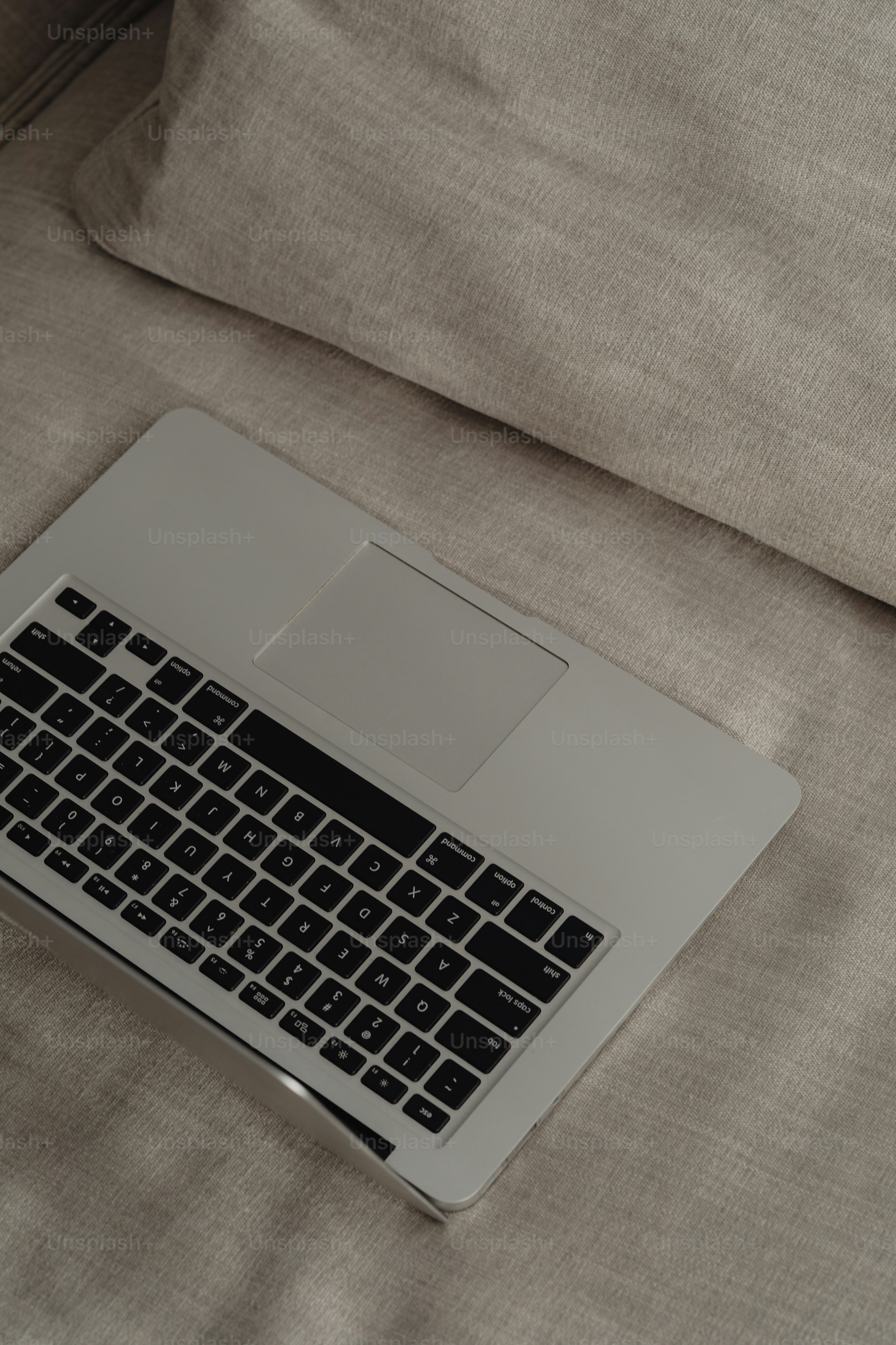 A laptop computer sitting on top of a table photo – Laptop keyboard ...