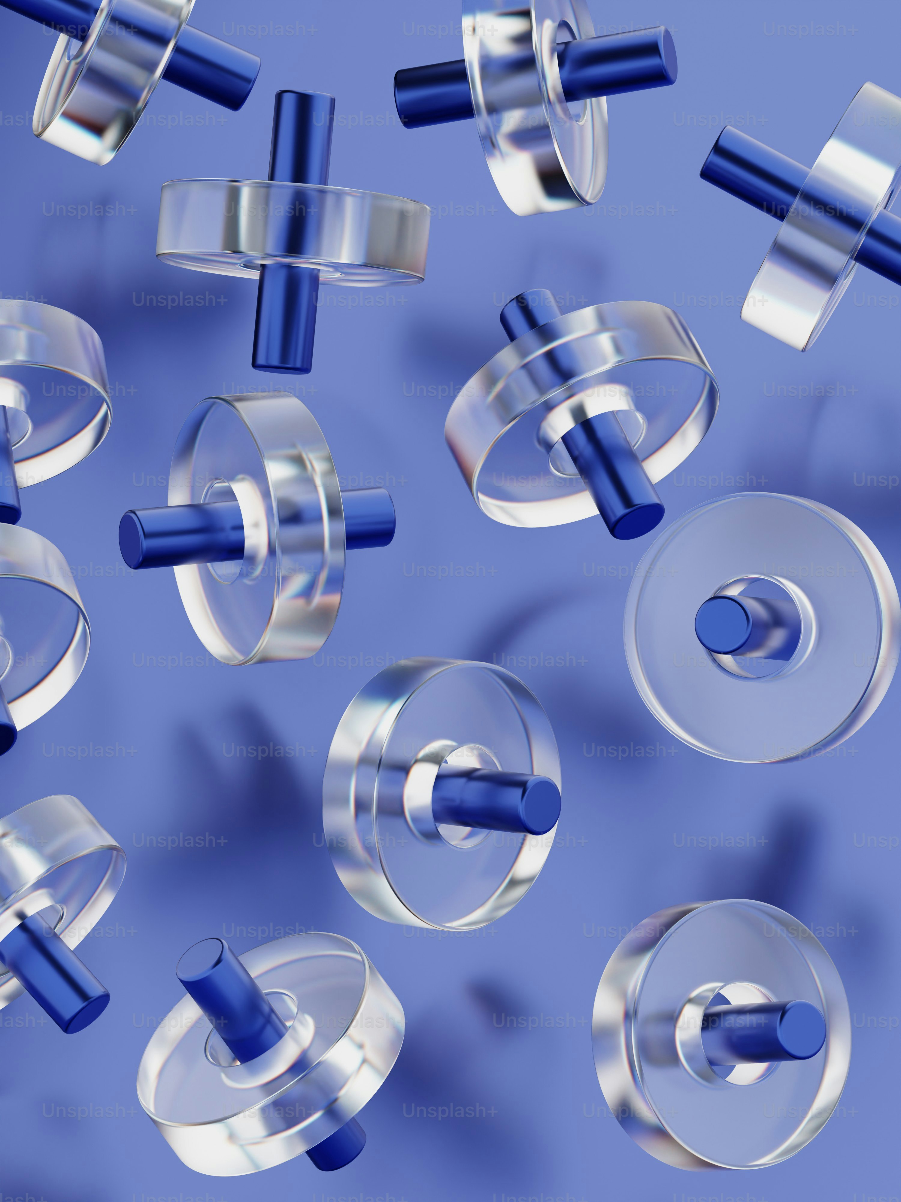 A group of metal objects flying through the air photo – Glass objects ...