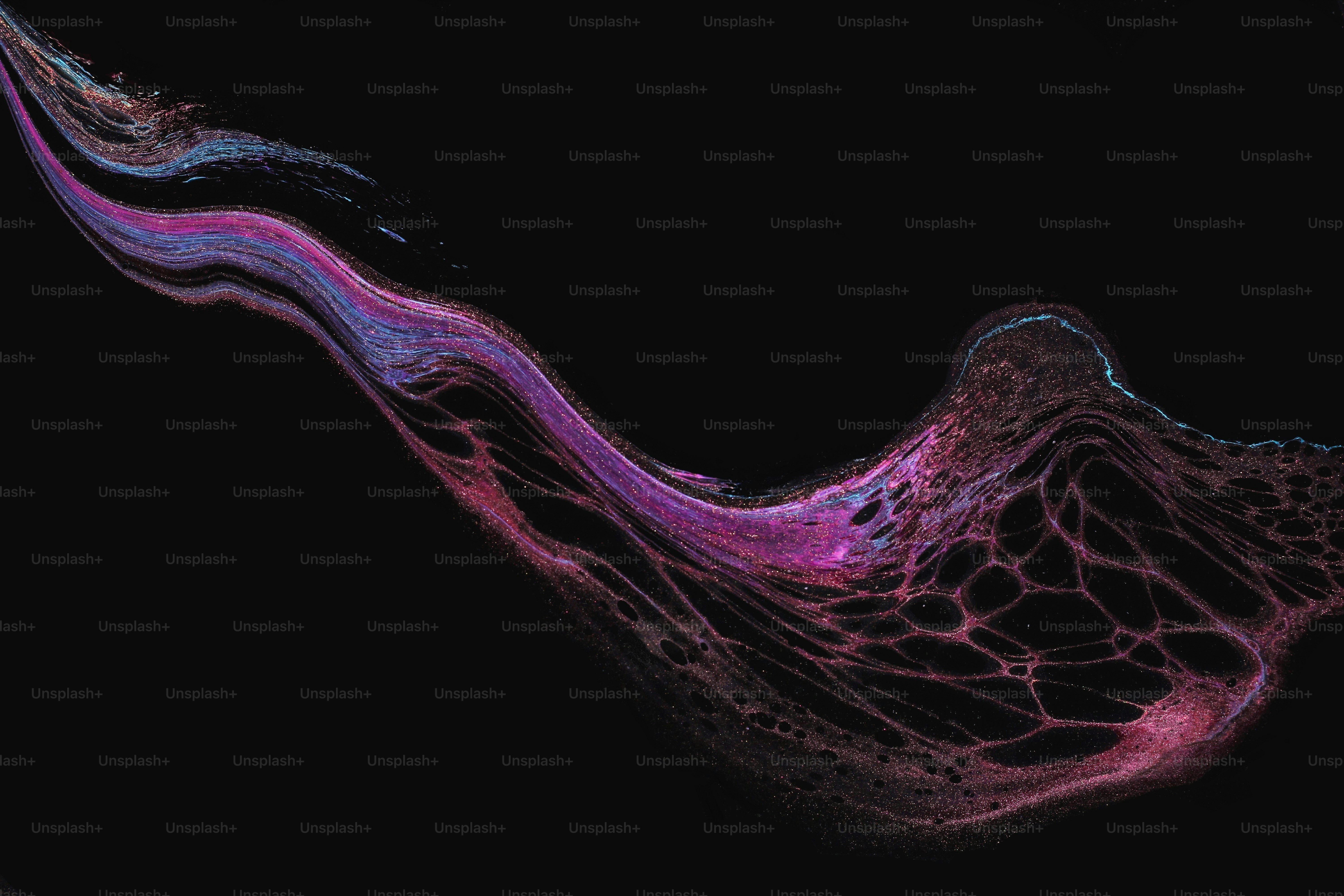 A close up of a cell phone with an orange and purple design photo ...