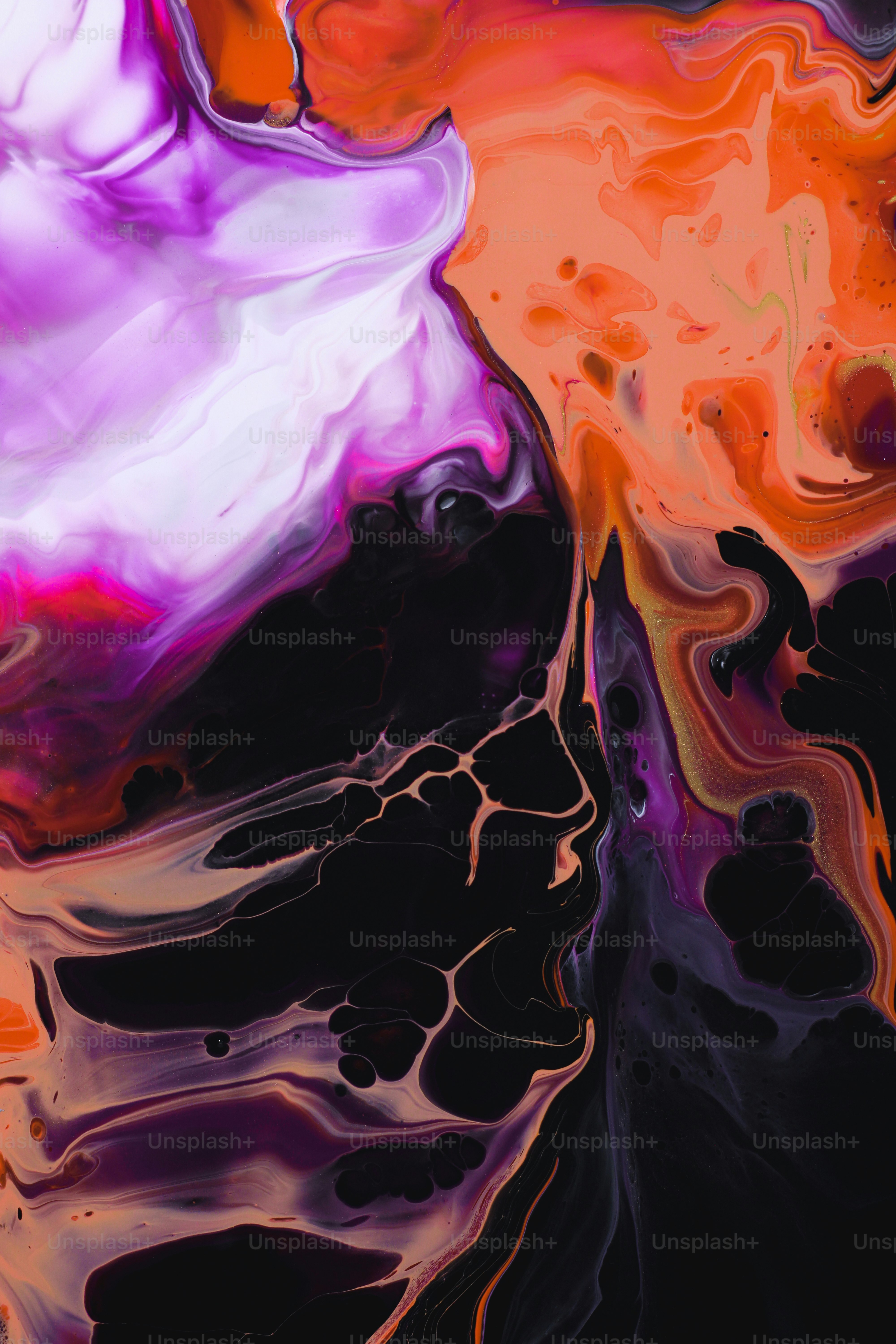 A close up of a cell phone with an orange and purple design photo ...