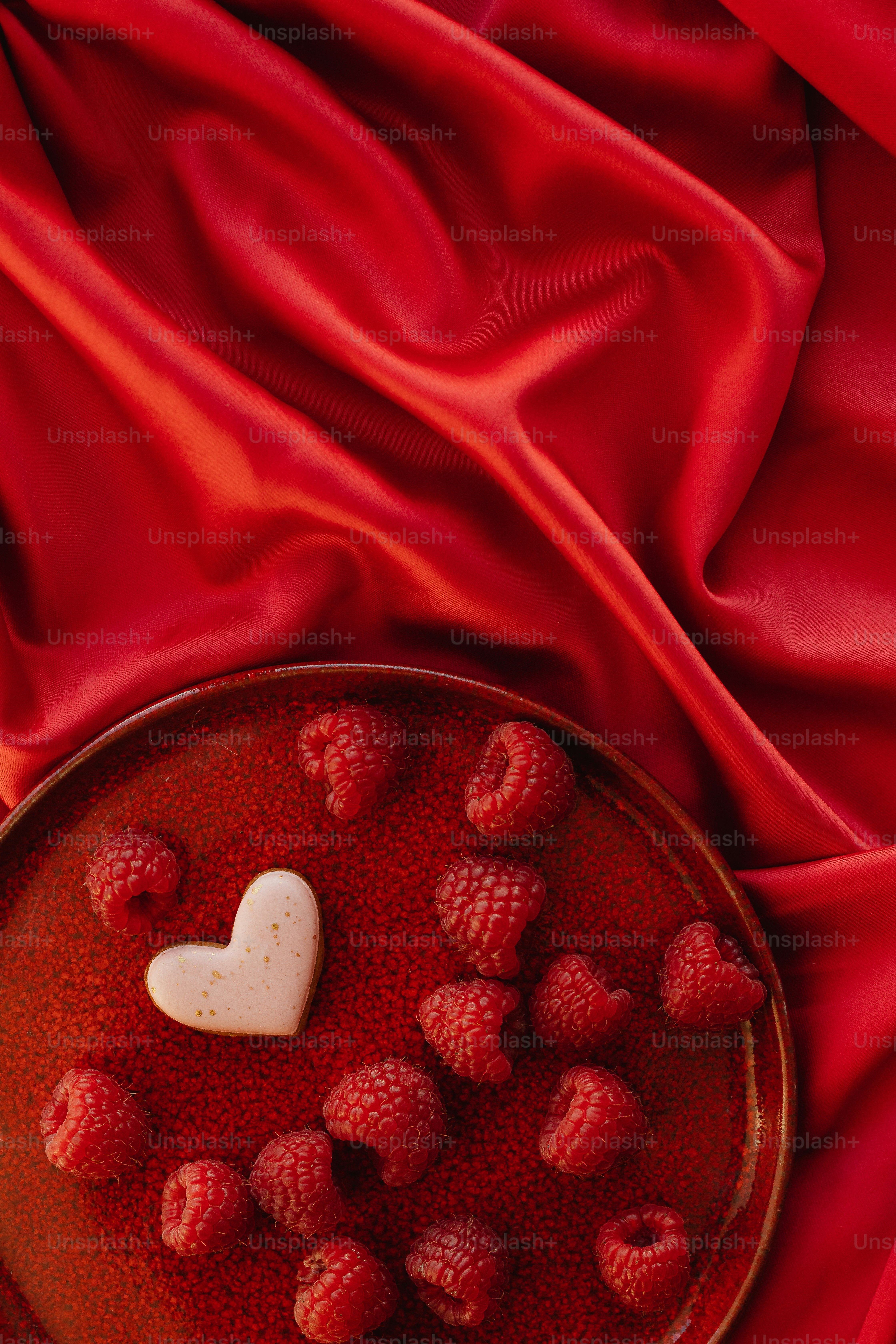 A bowl of raspberries with a heart on top photo – Valentines day Image ...